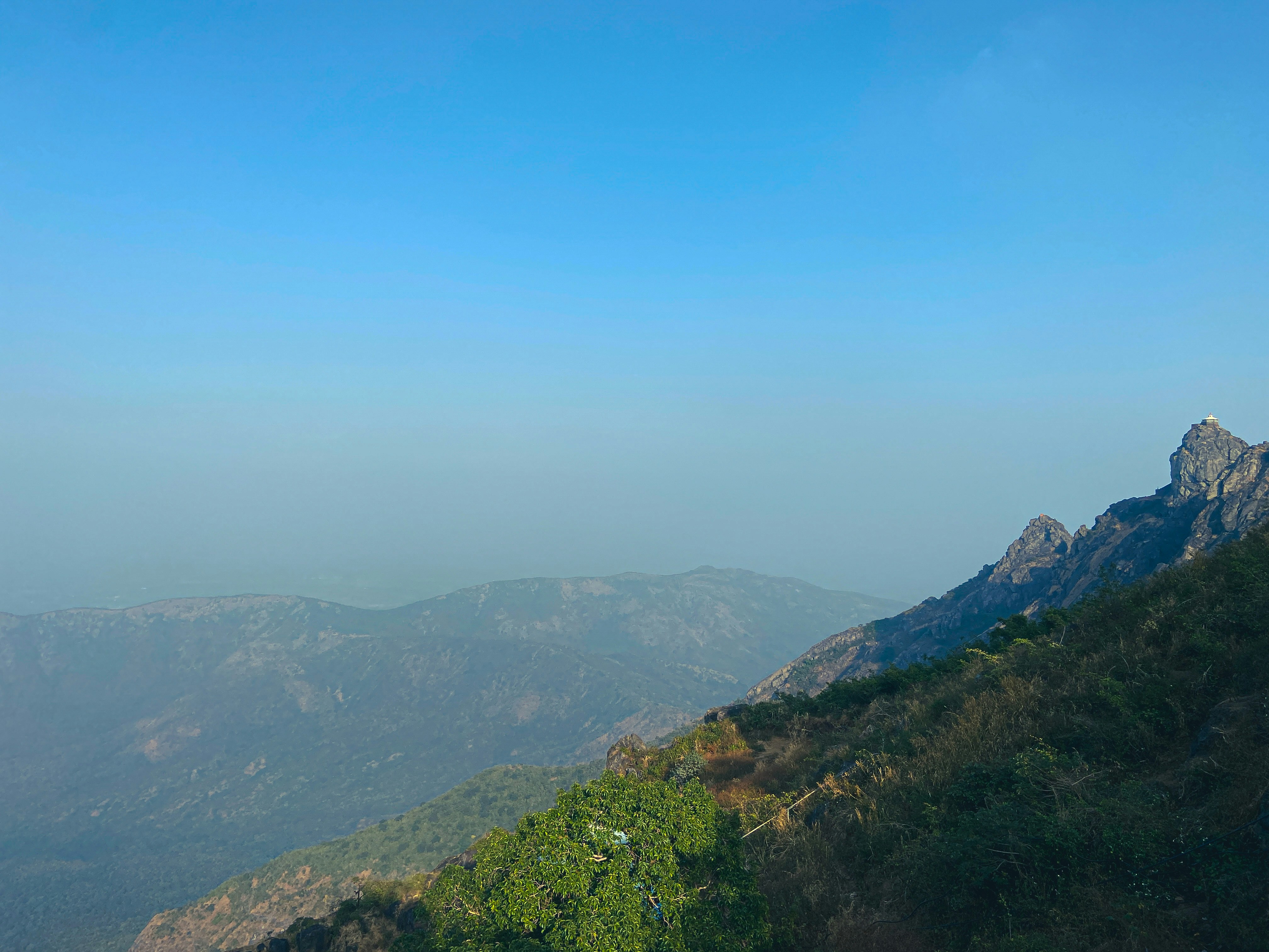 A view of a mountain range from a distance photo – Free Girnar hills ...