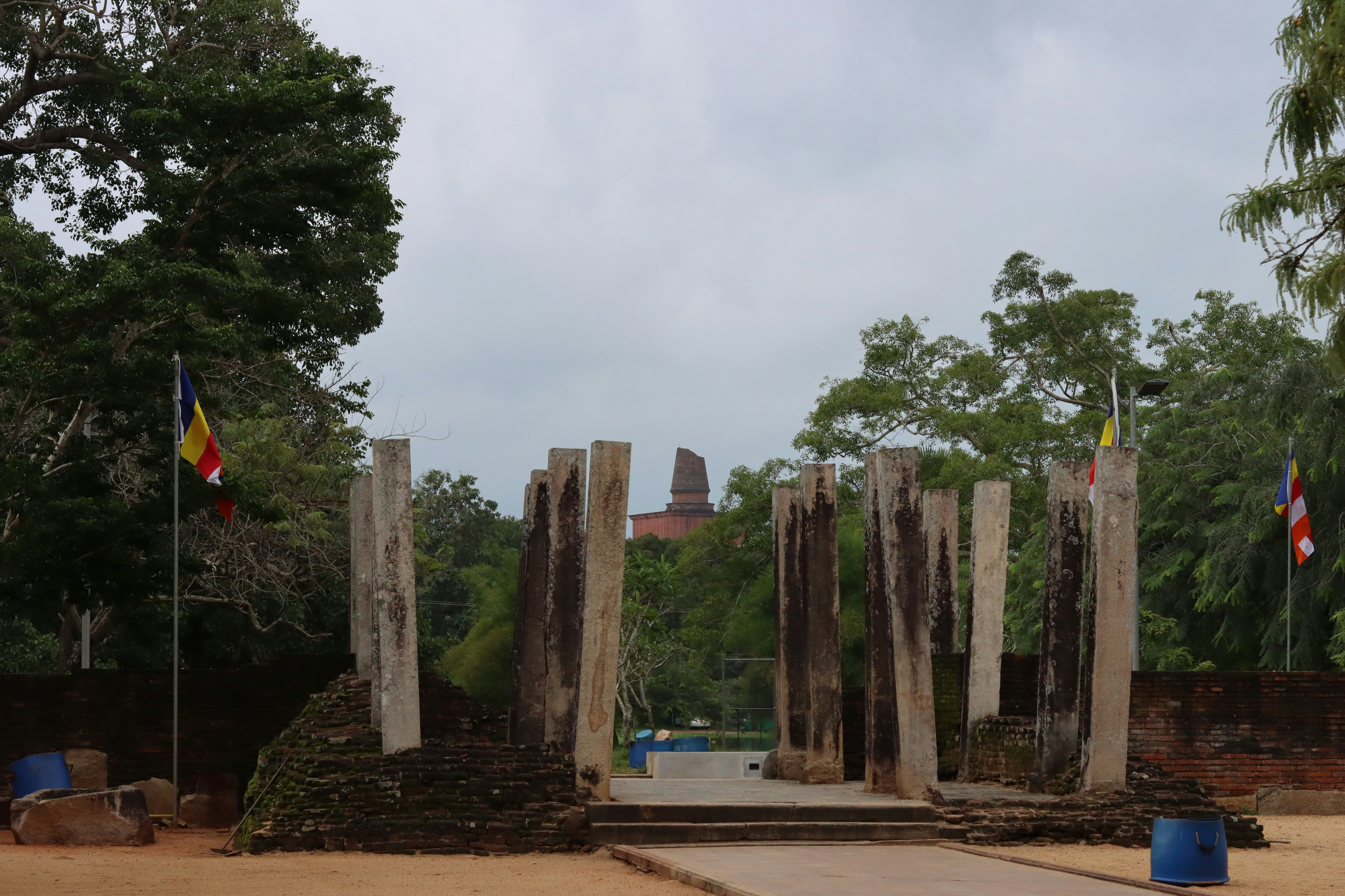 Ancient Pillars Amidst Lush Greenery