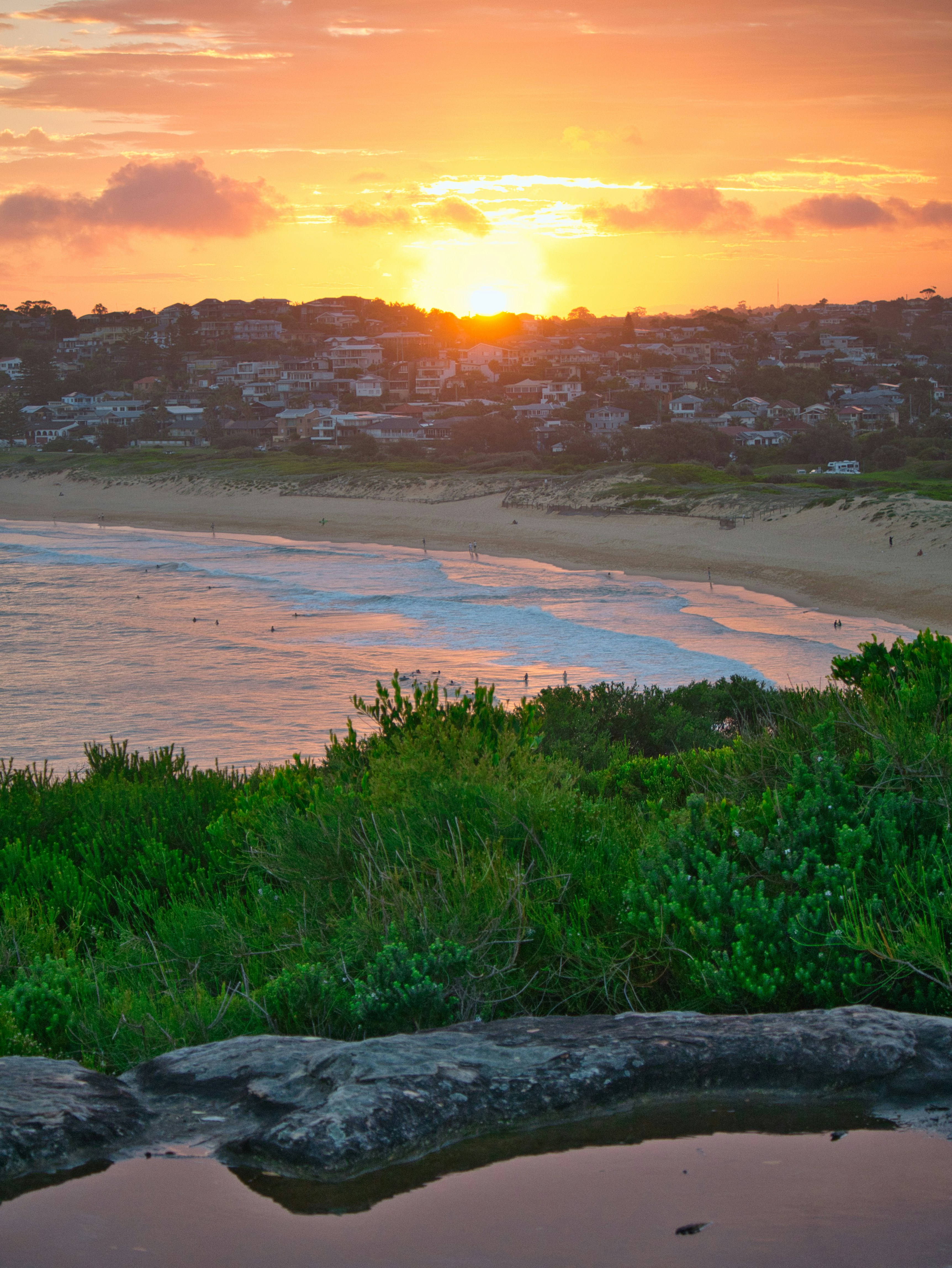Sunset at the Edge: A Quiet Coastal Village Basks in Golden Light