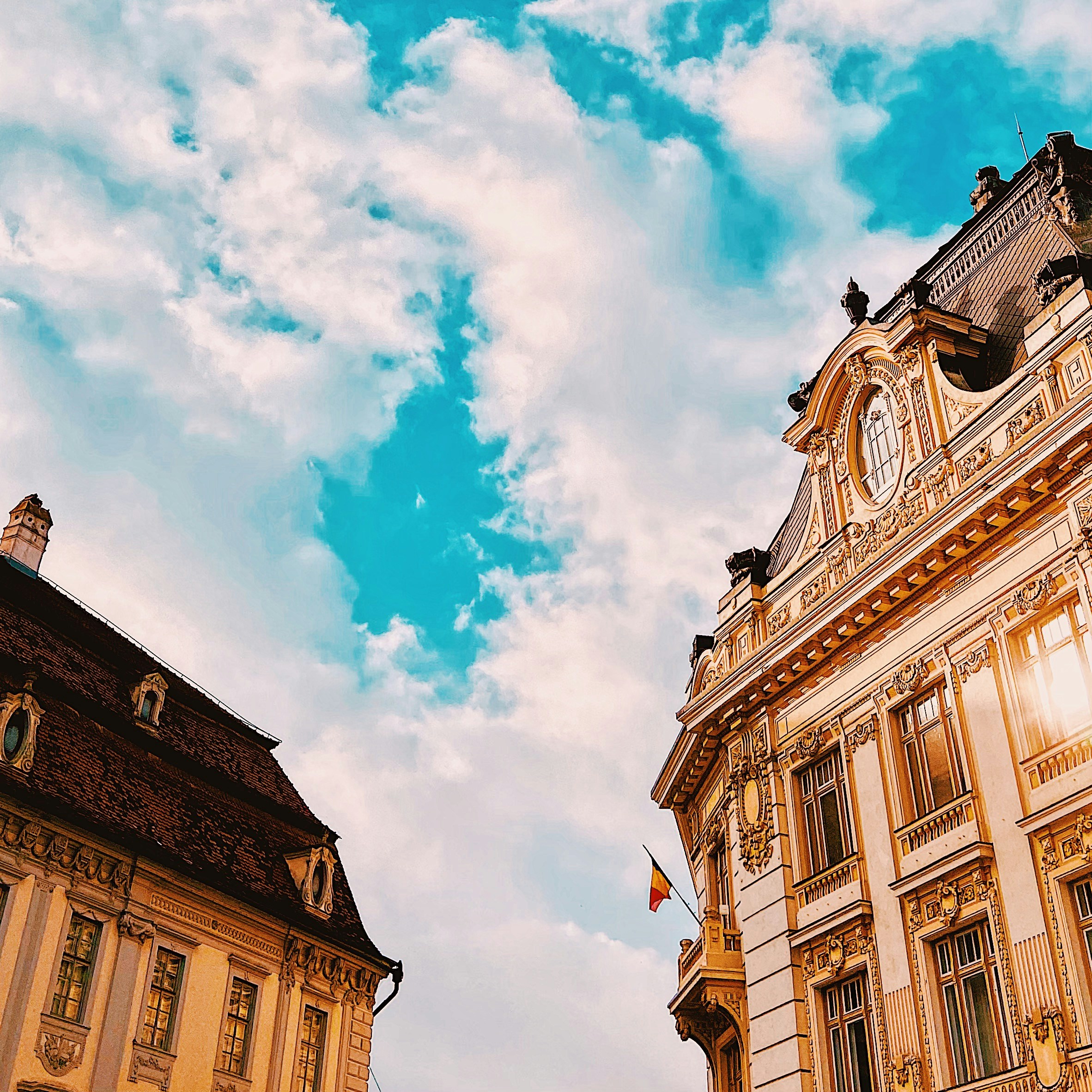 Old buildings in old city centre Sibiu, Romania. Beautiful sunset in a cold winter. 