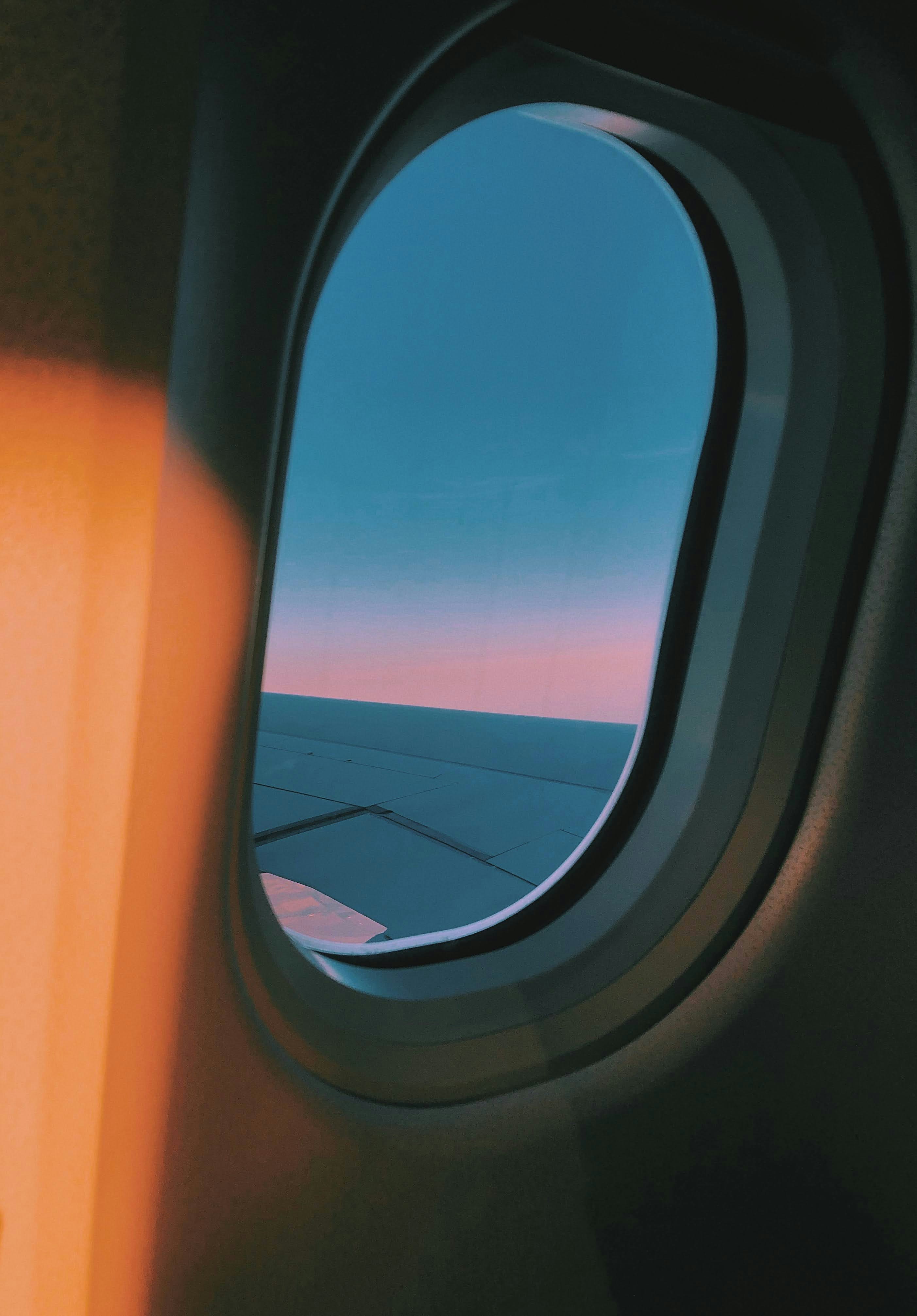 Pastel Strata Framed by an Airplane Window