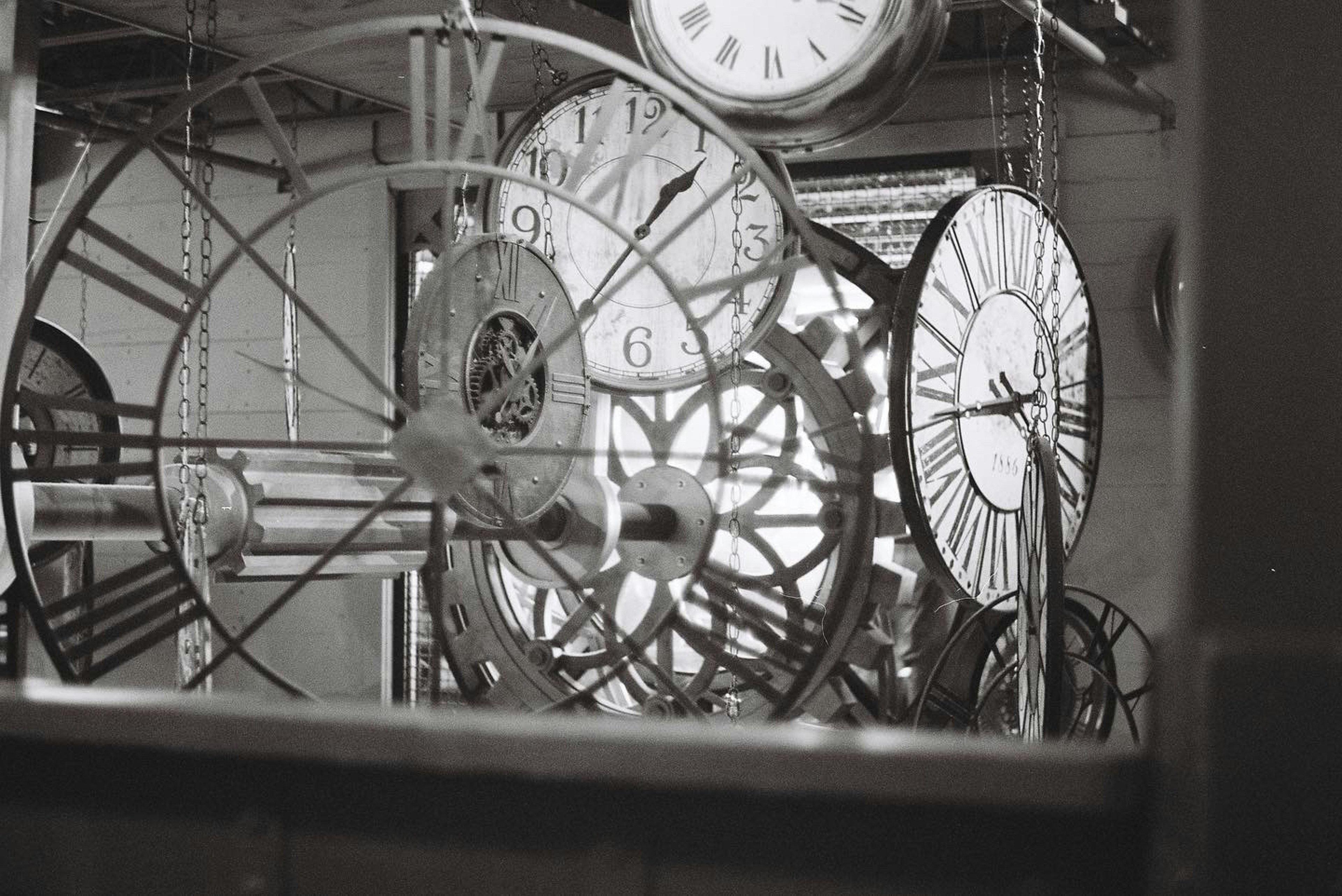 A bunch of clocks hanging from the ceiling photo – Free Grey Image on ...
