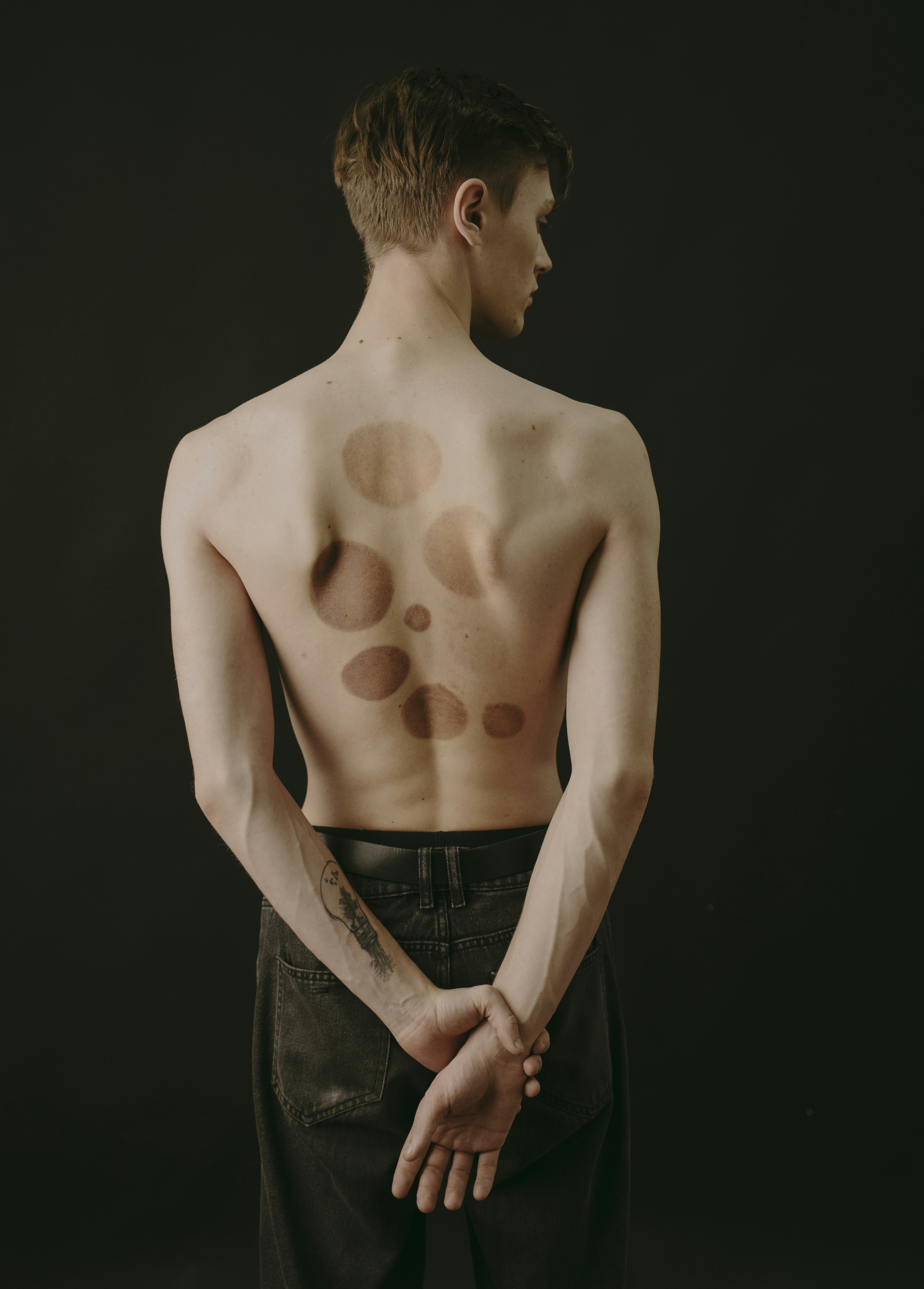 Backlit Atlas: The Marked Back