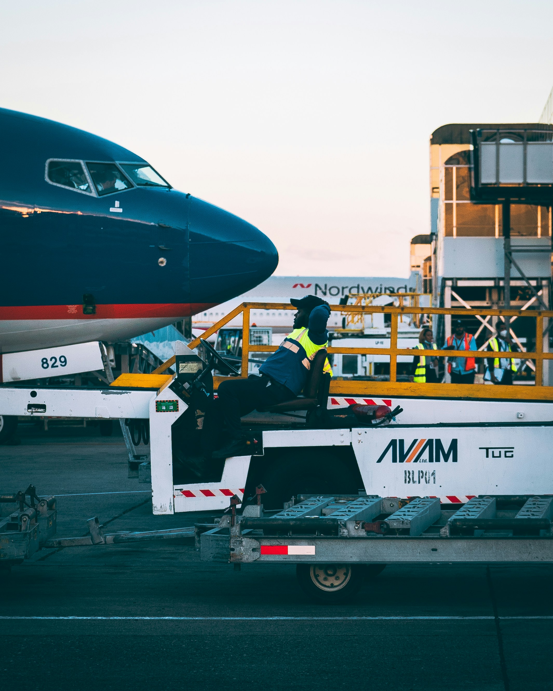 Blue Nose at the Gate: Ground Crew in a Quiet Jet-Bridge Moment