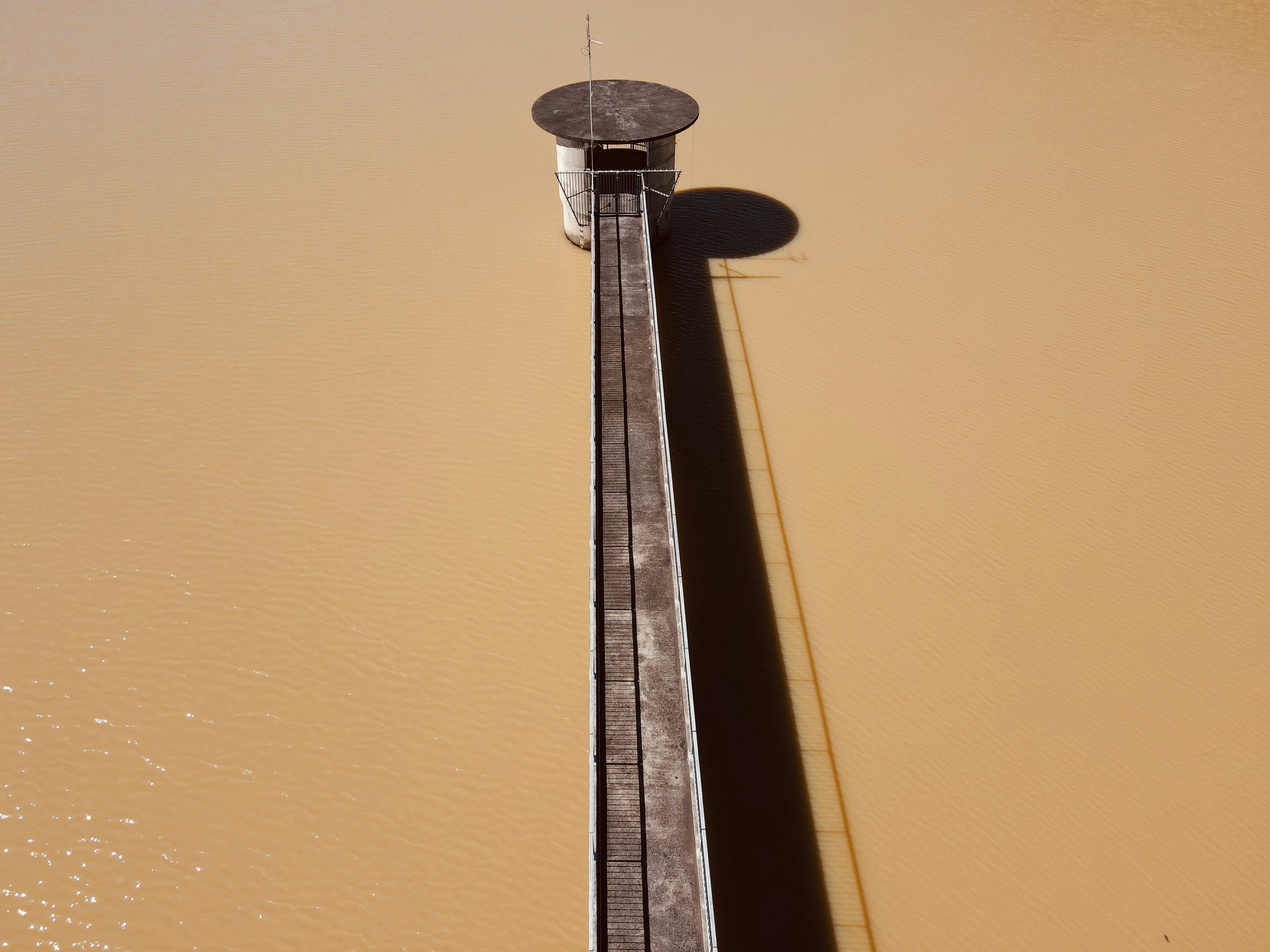 a boat dock in the middle of a body of water