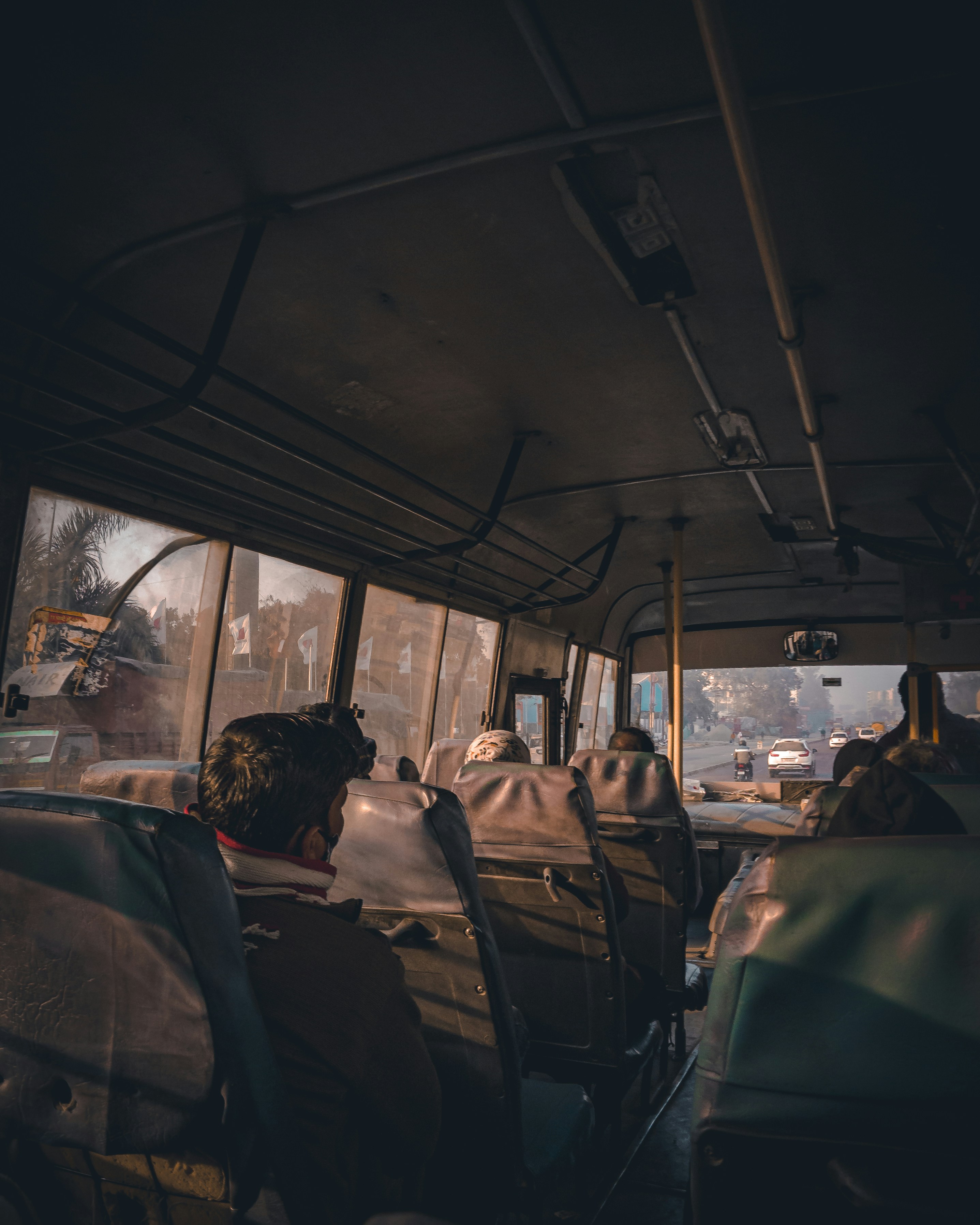 A group of people sitting on a bus looking out the window photo – Free ...