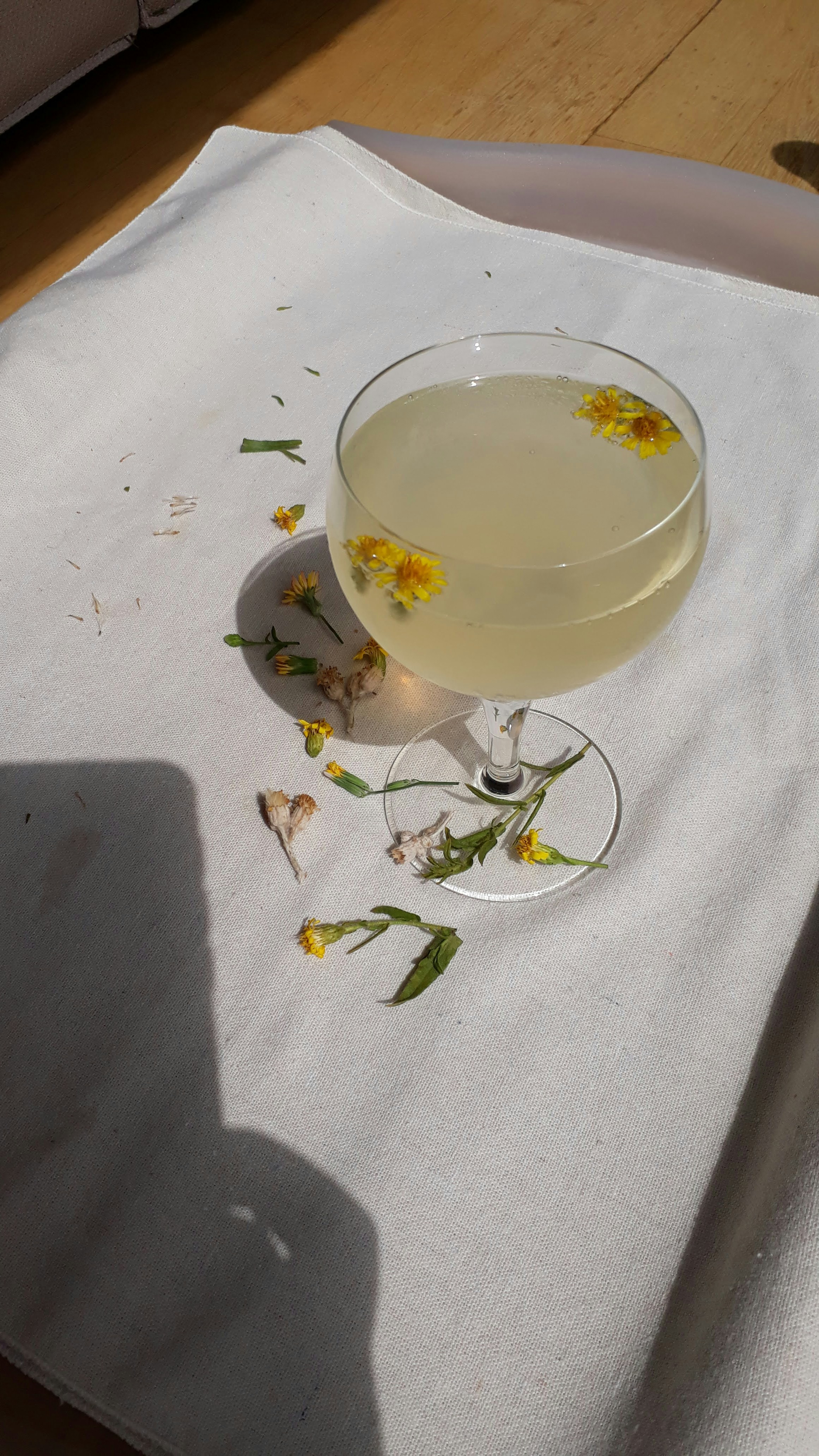 Sunlit Glass of Citrus Echoes on White Linen