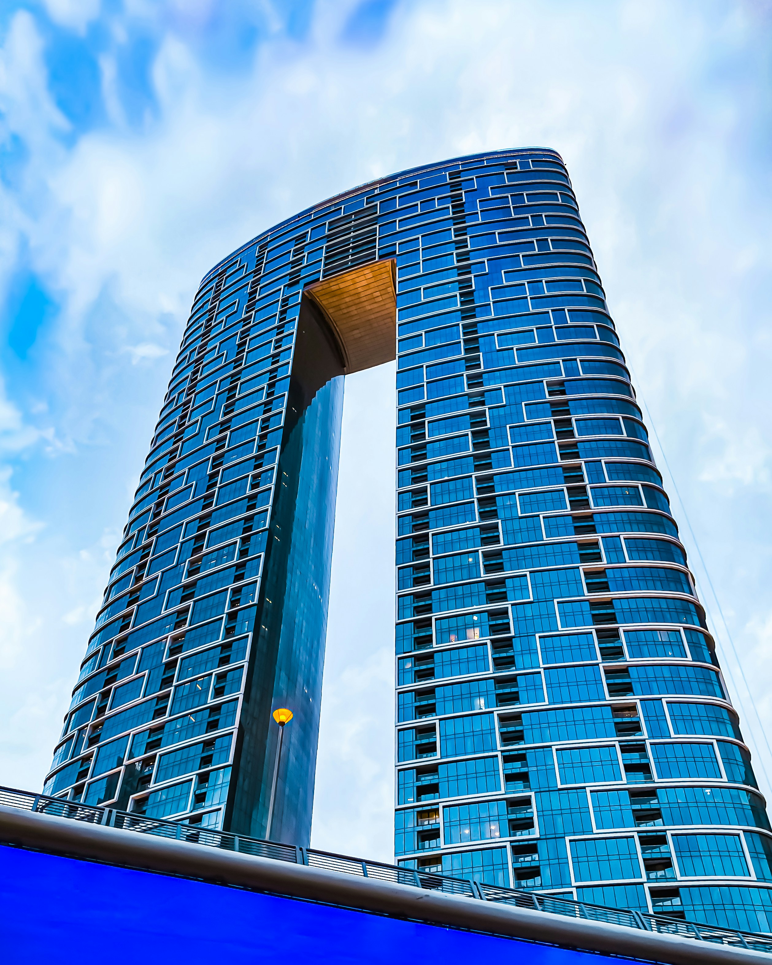 A tall blue building with a sky background photo – Free Blue Image on ...