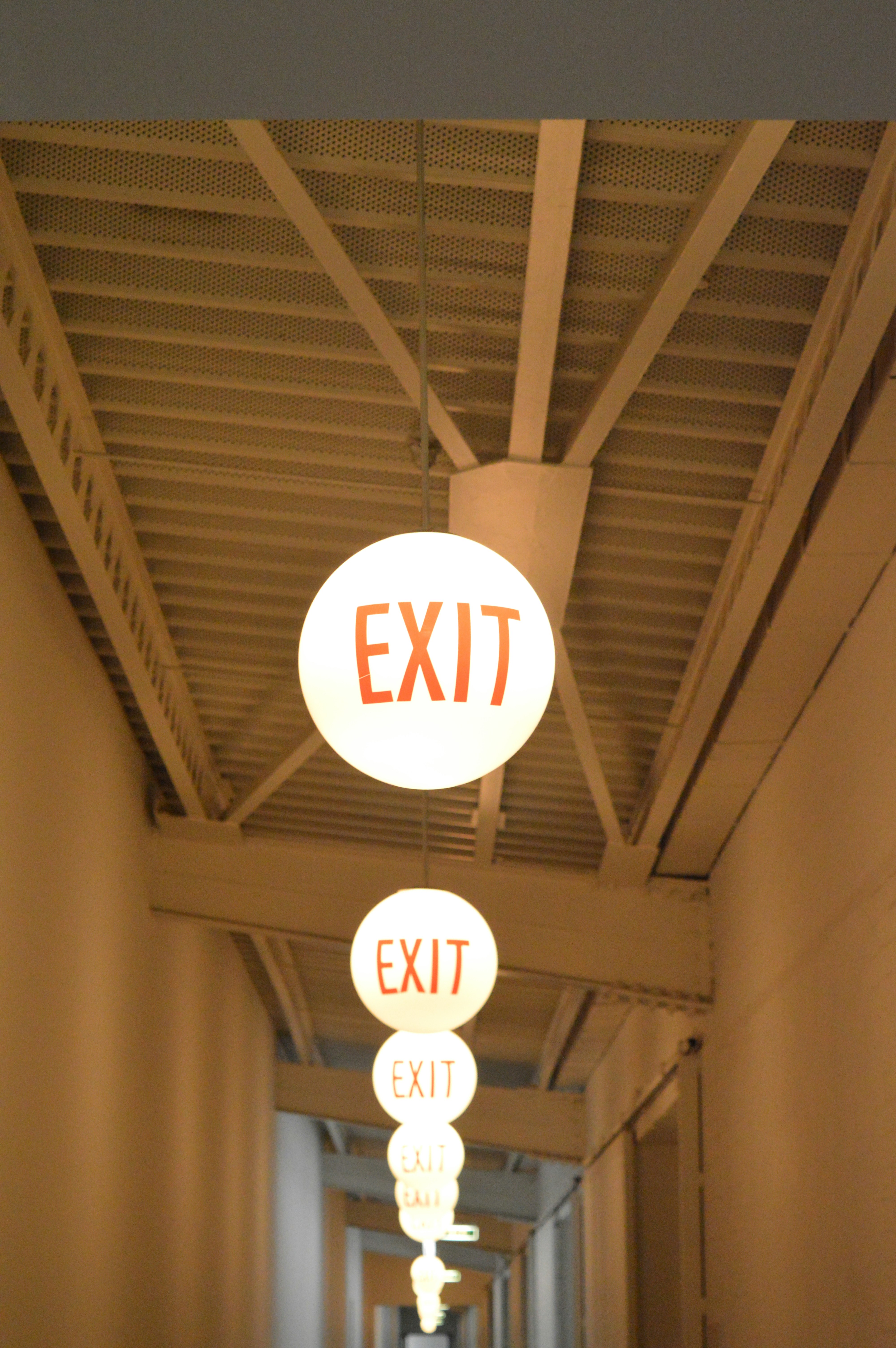 Exit Orbs Line the Corridor: A Quiet Recede