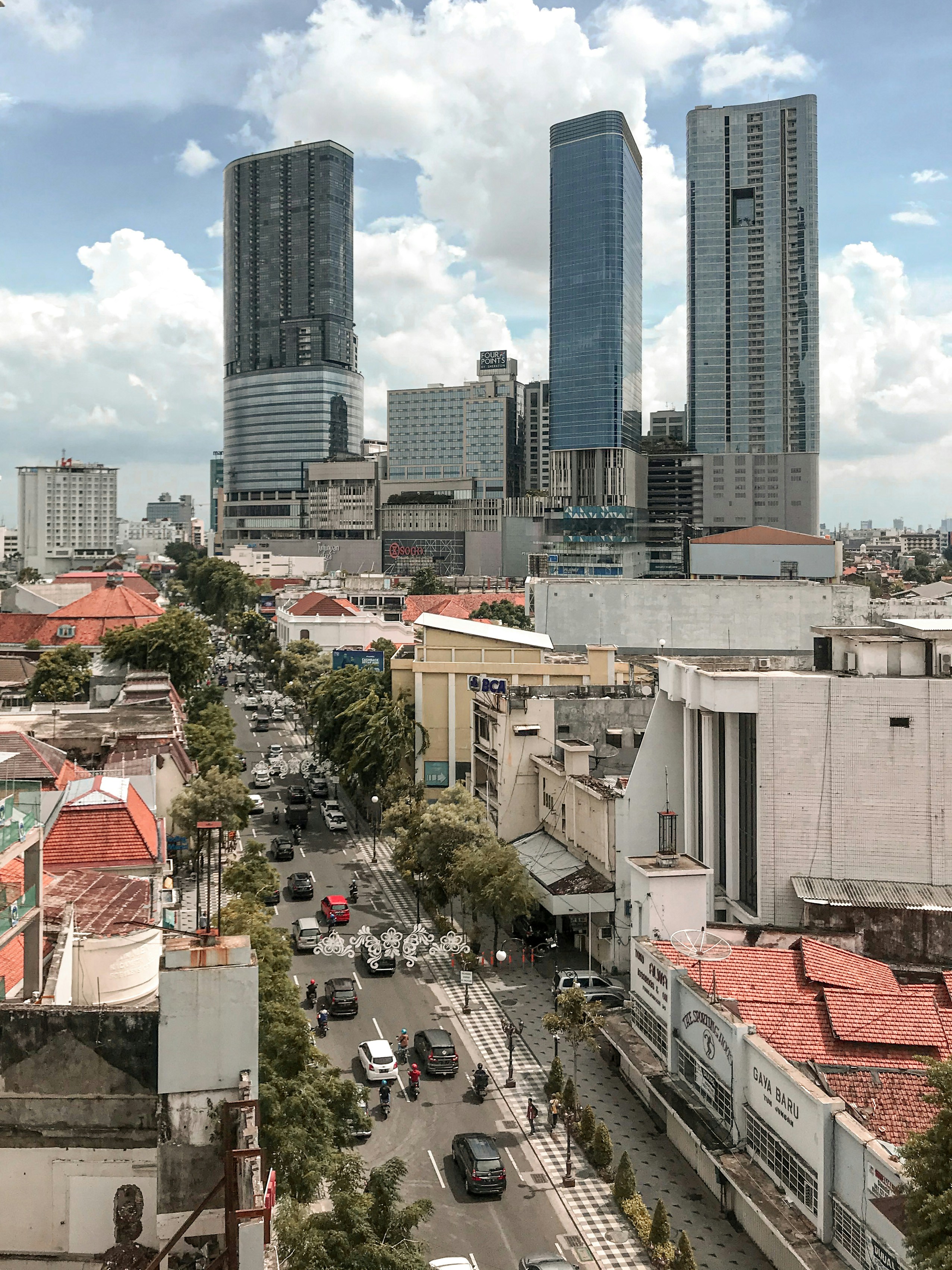 Tunjungan Street | a view of a city with tall buildings