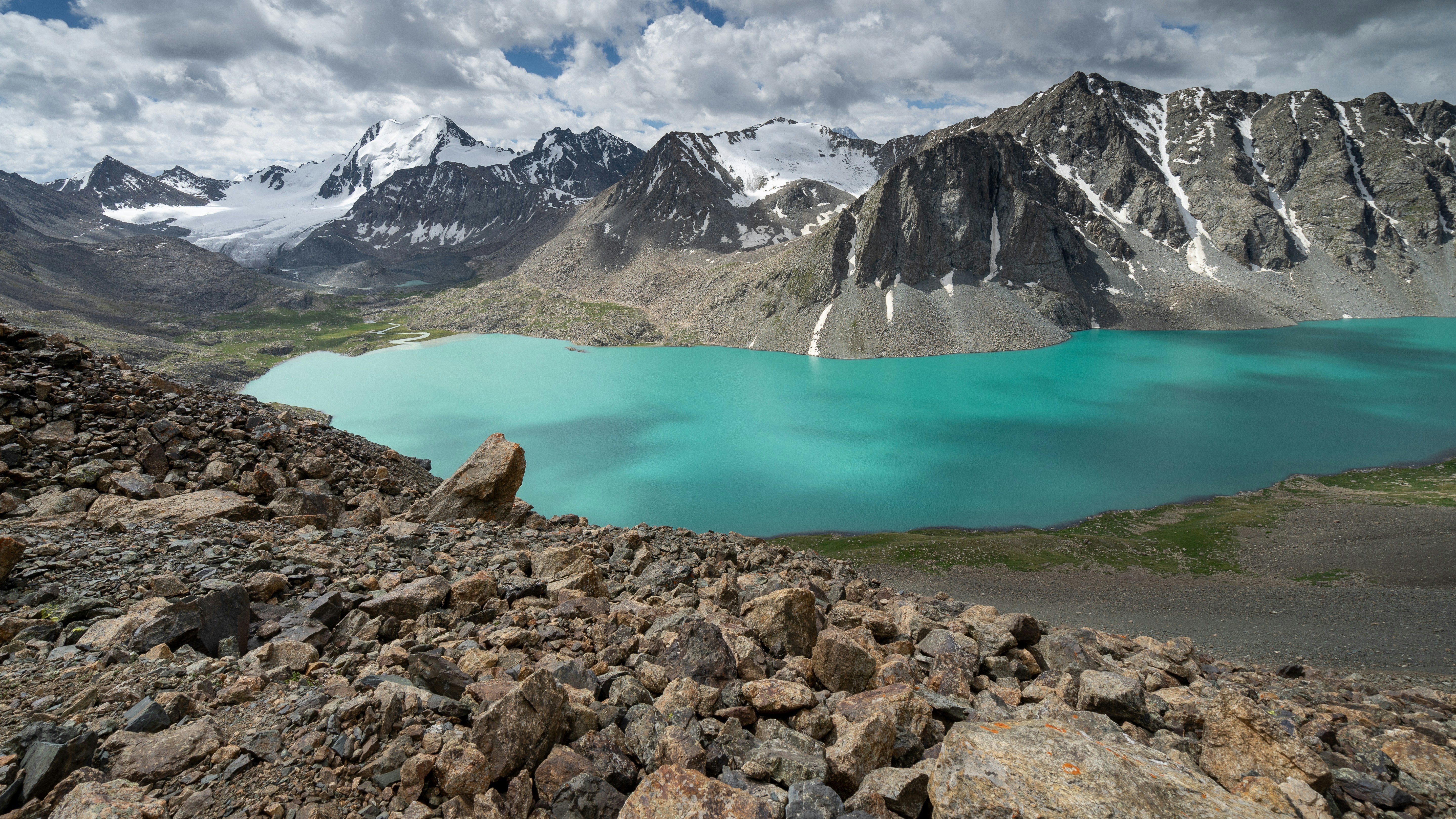 Turquoise Tarn Between Rugged Peaks