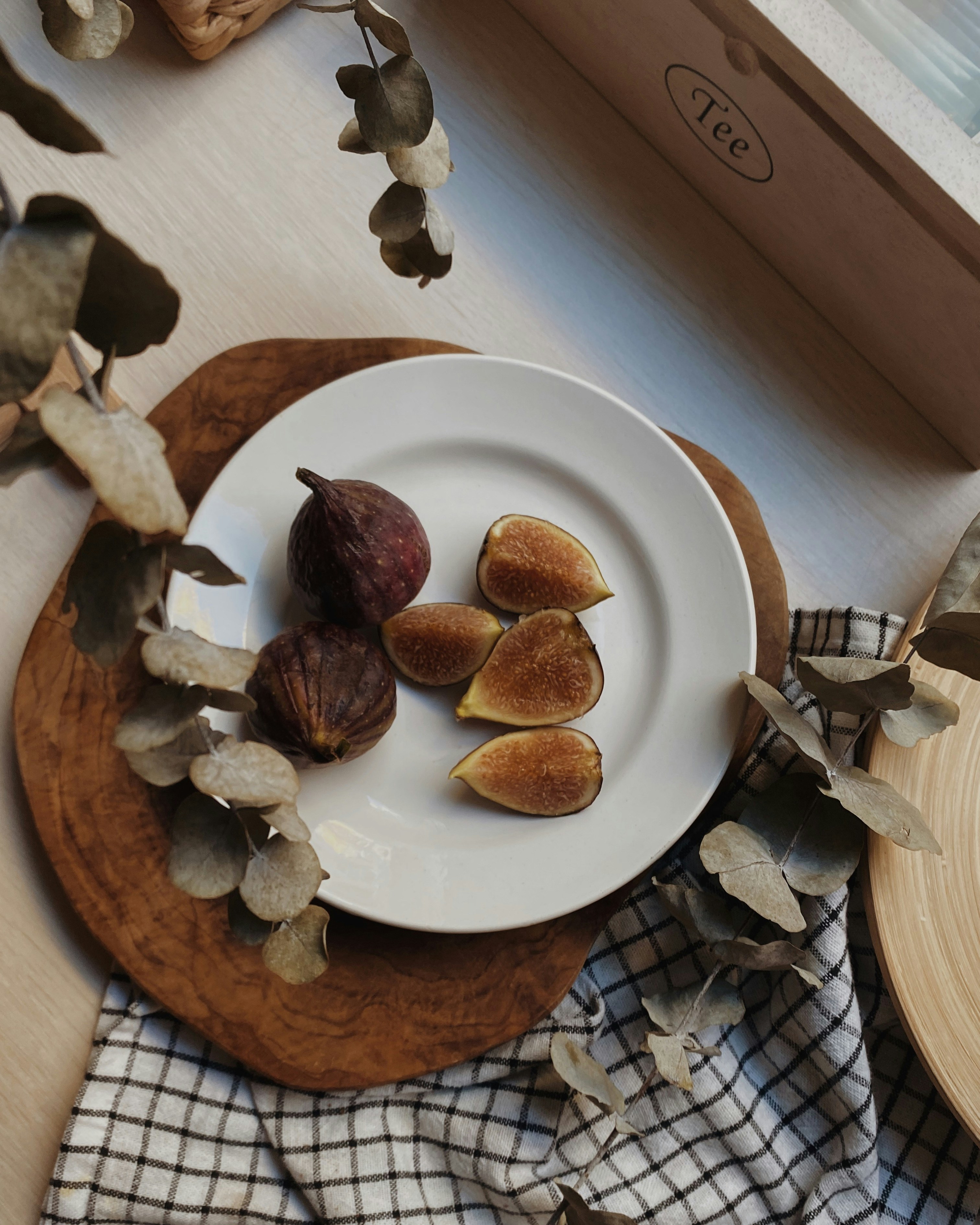 Fig and fig-cut Treats on a Rustic Wooden Plate
