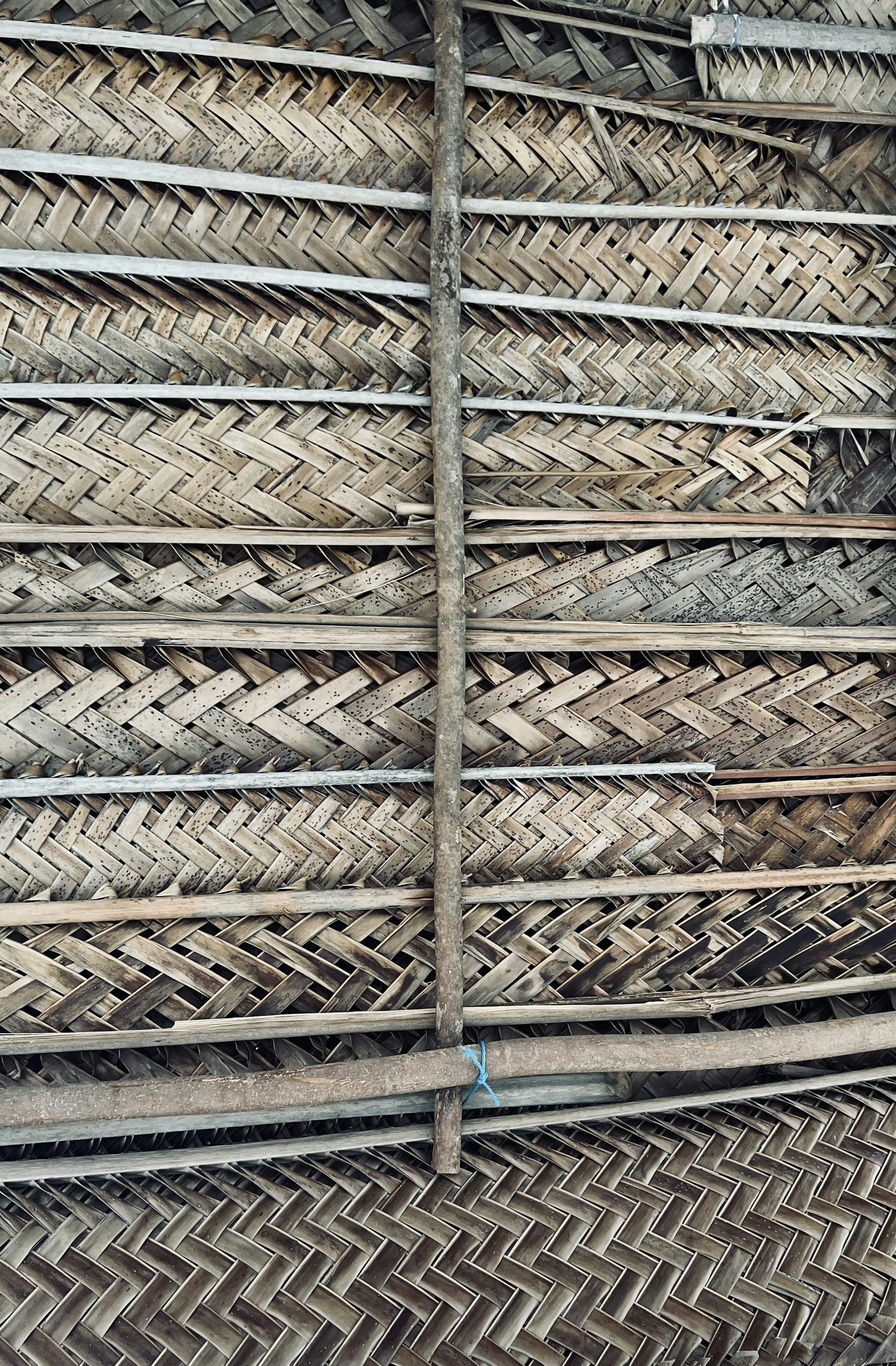 Ribbed Harmony: Close-Up on a Weathered Bamboo Wall