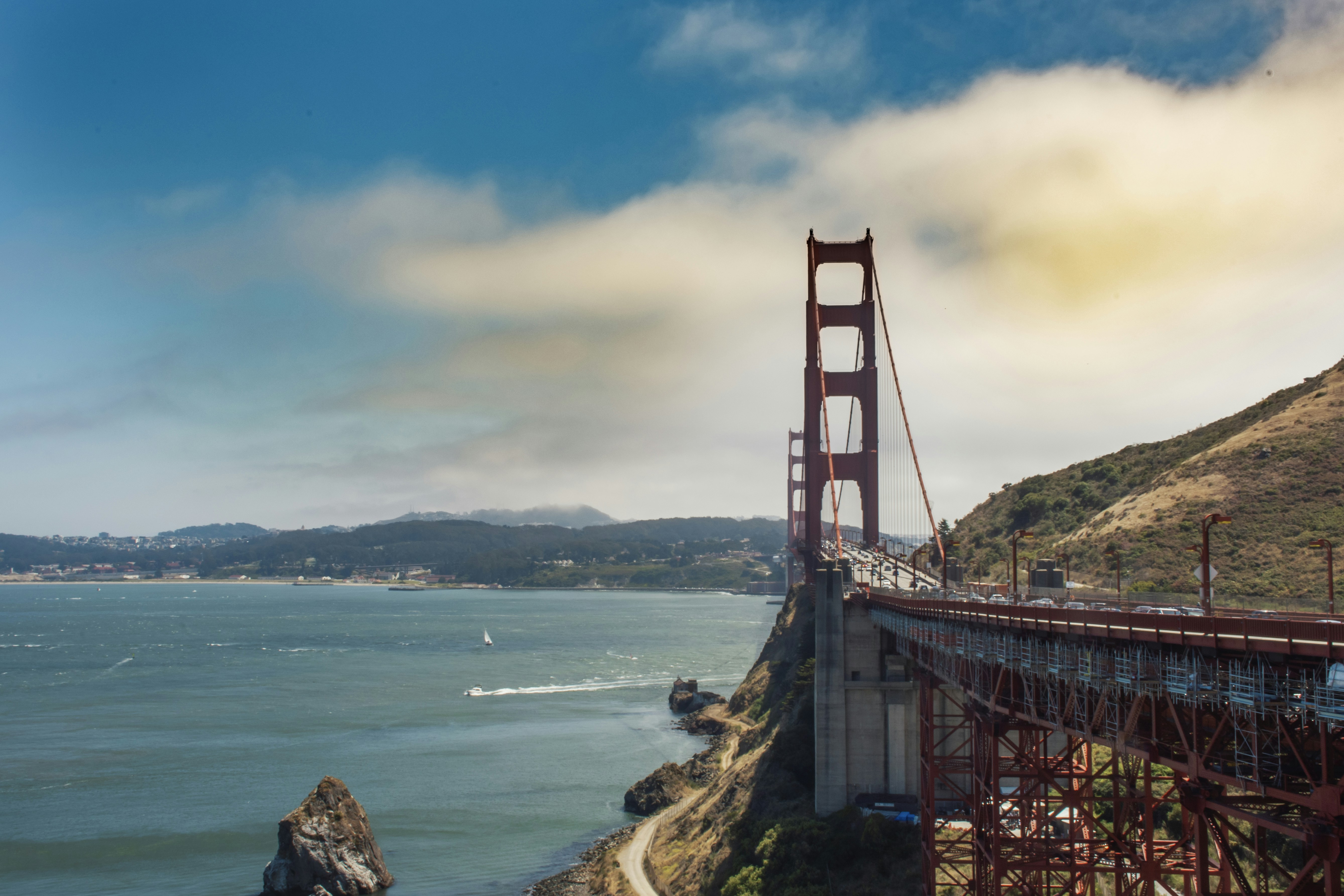 A view of the golden gate bridge over the ocean photo – Free Building ...