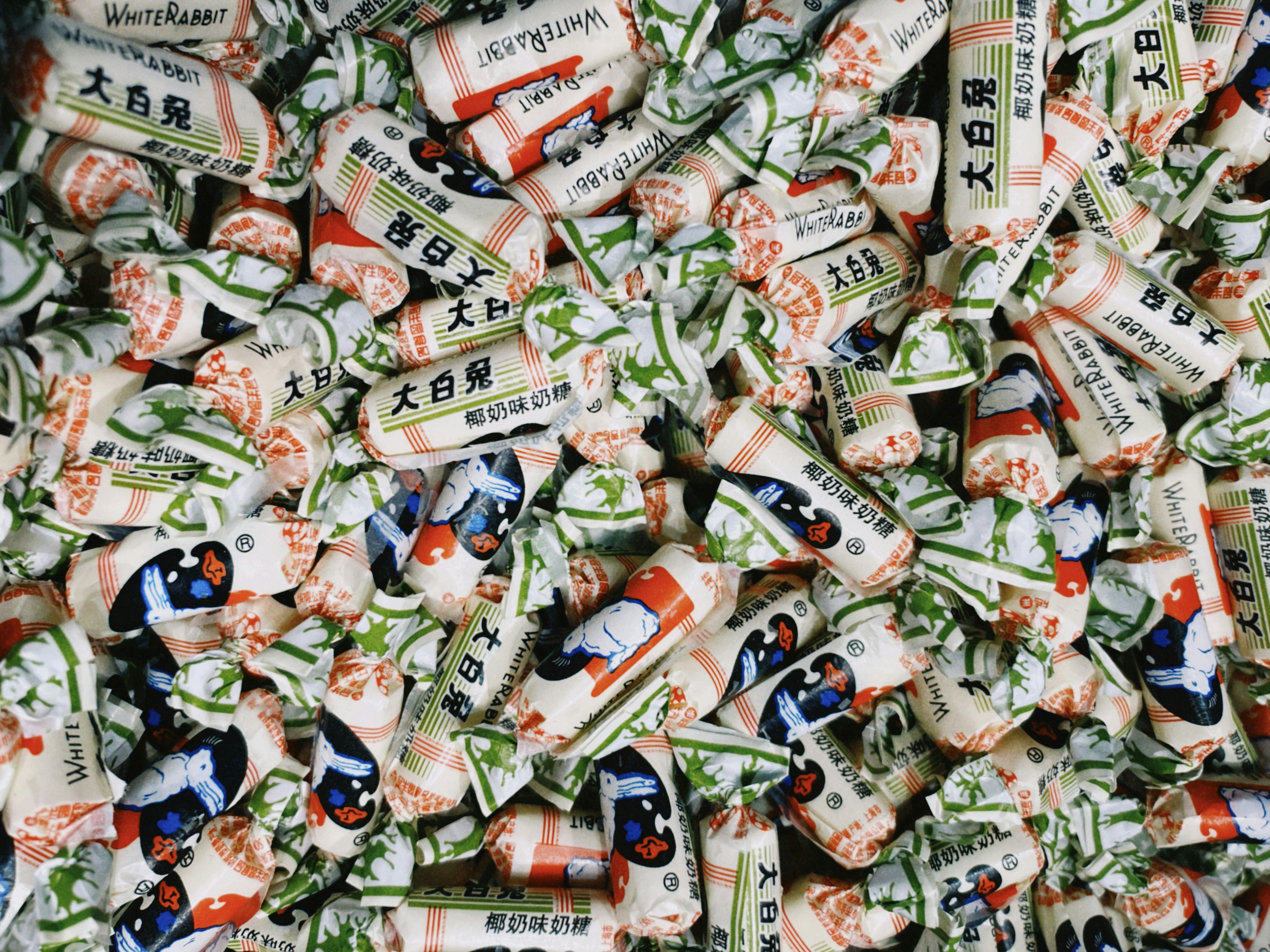A pile of candy wrapped in japanese candy wrappers photo – Free Grey ...