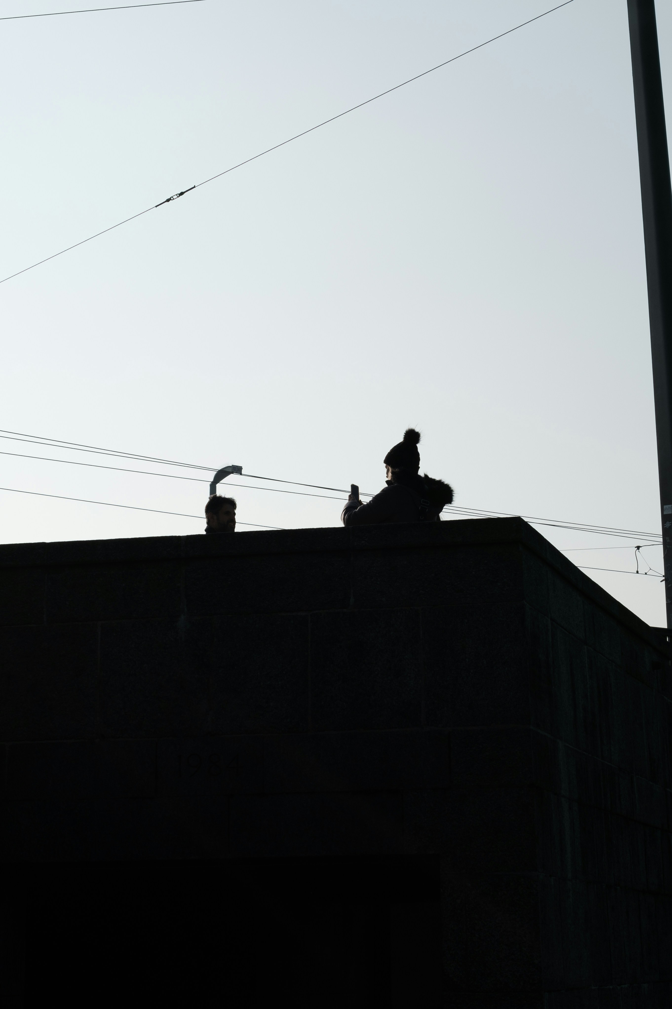 a person sitting on top of a building