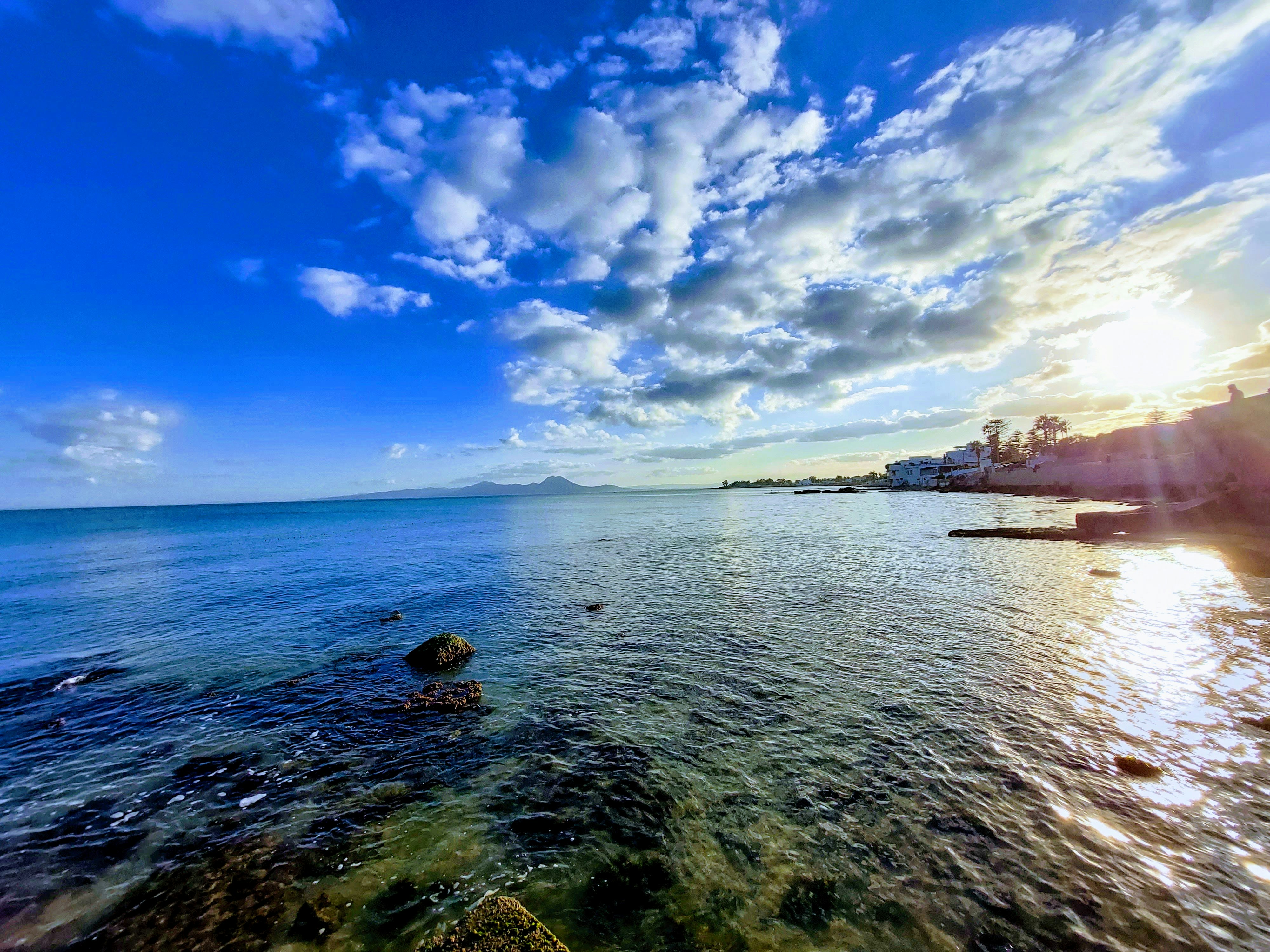 A view of the ocean from the shore of a beach photo – Free Carthage ...