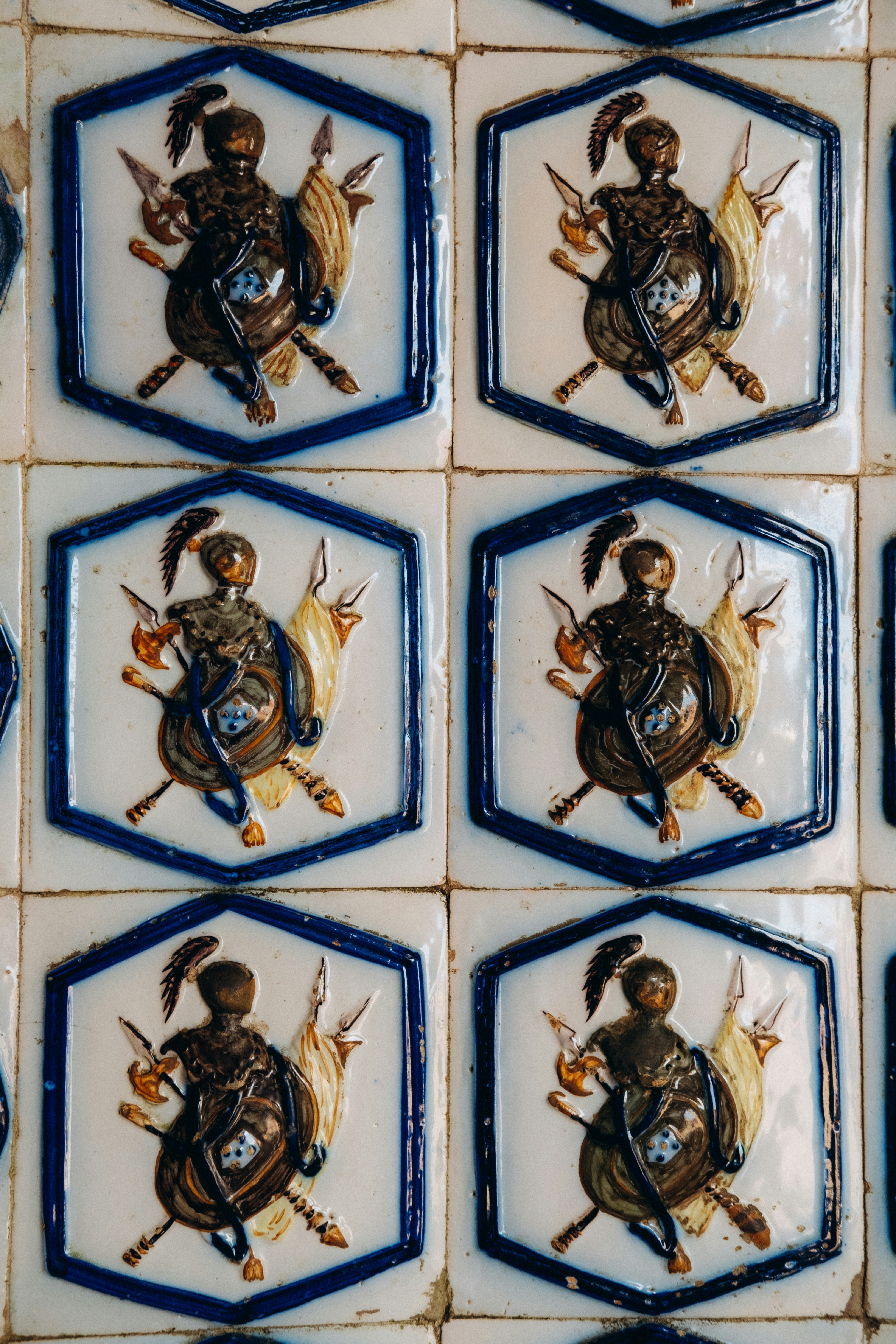 Blue Hex Knights: Repeating Ceramic Heraldry in a Grid