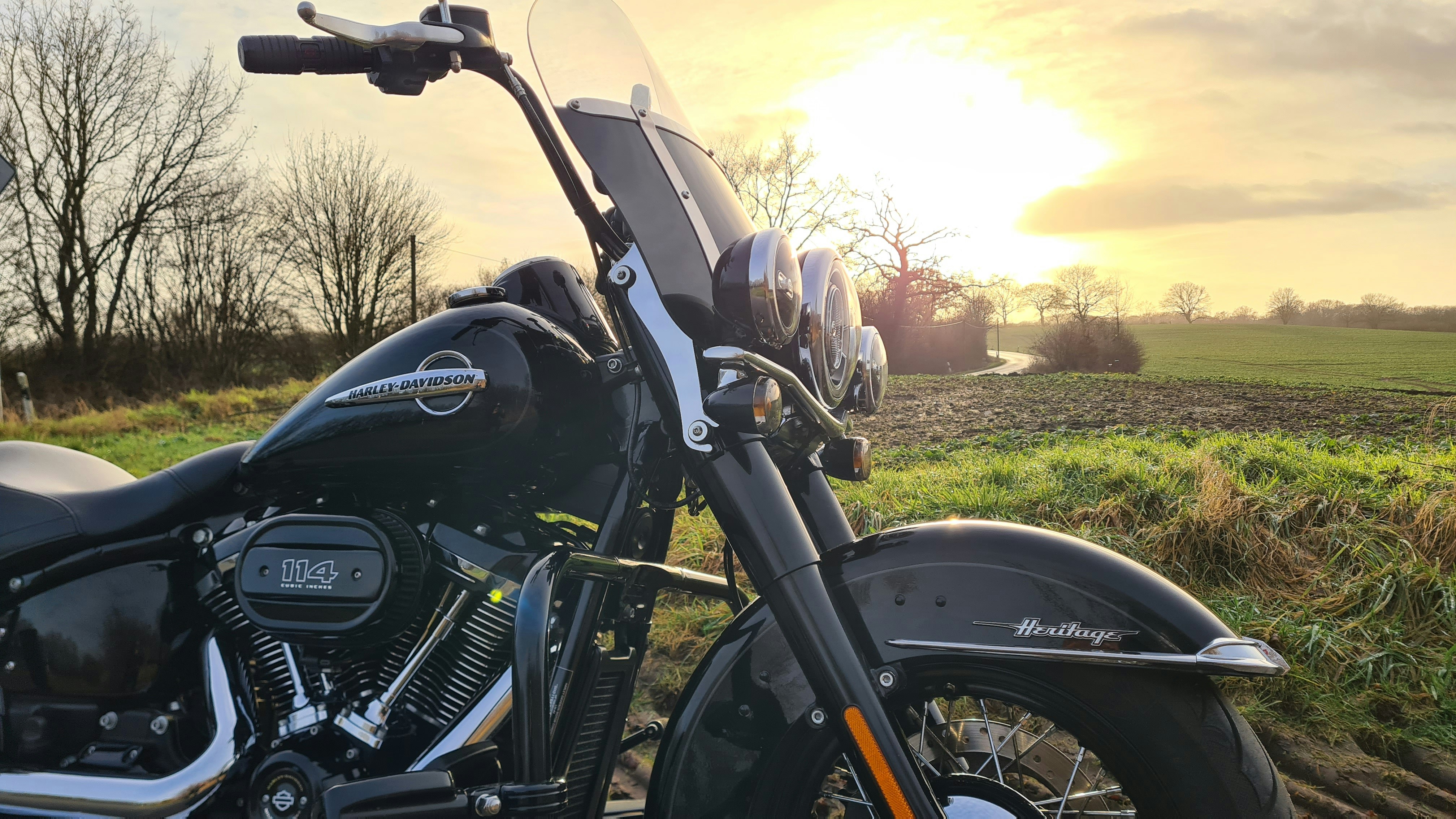 Sunlit Steel: A Quiet Ride by the Riverbank