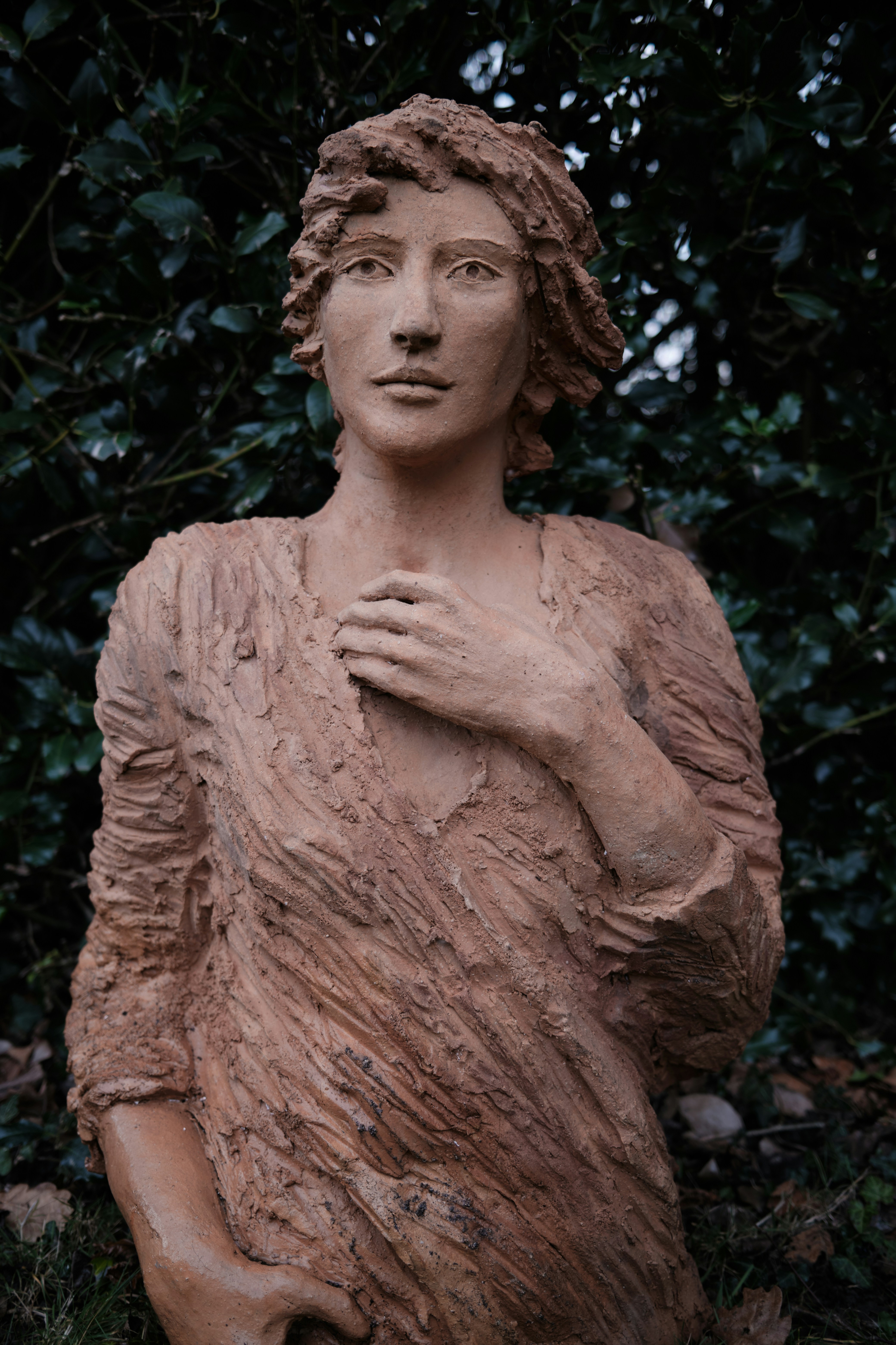 A statue of a woman with her hands on her chest photo – Free Sculpture ...