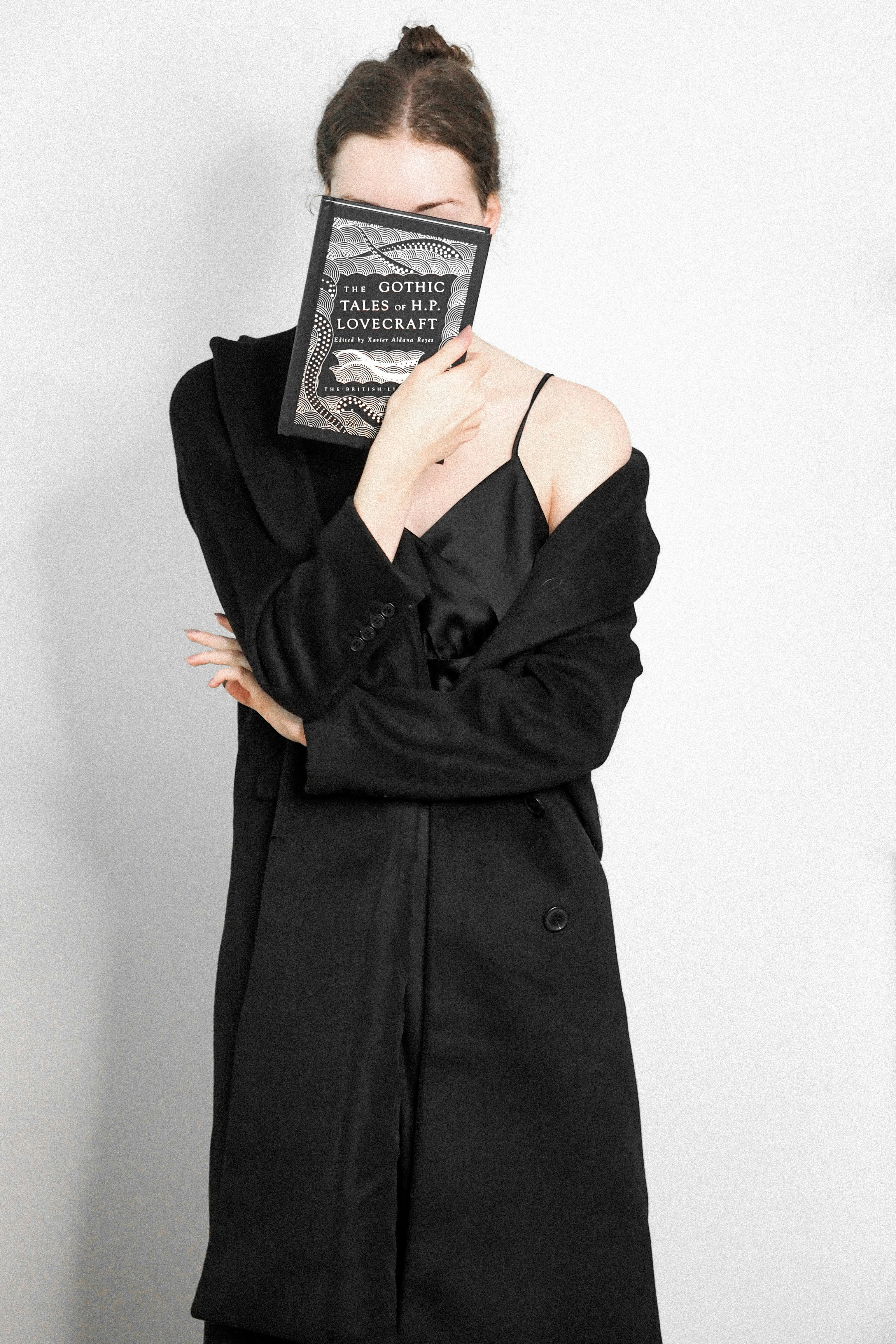 Hidden Tales: A Portrait with a Book as Shield