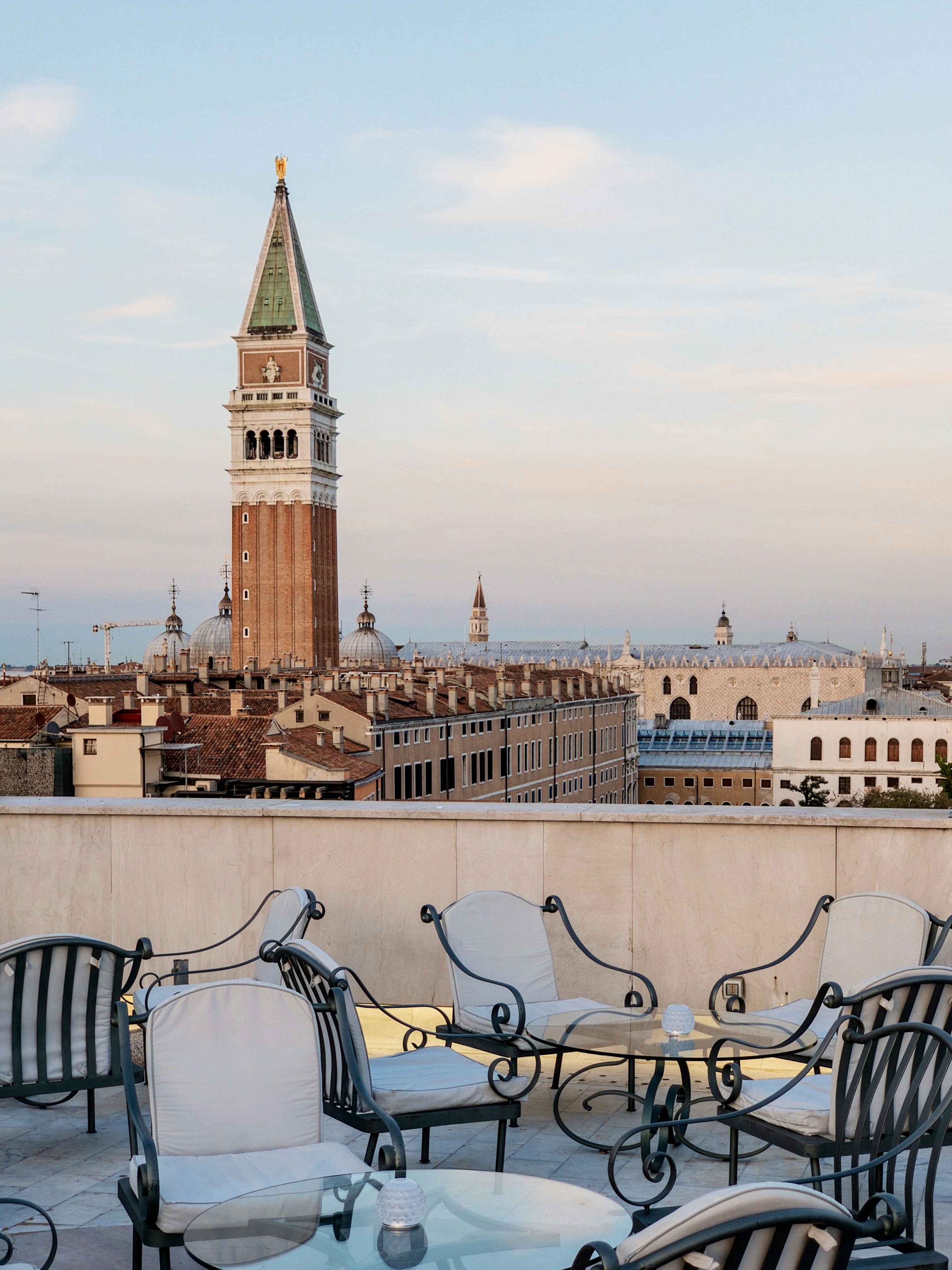 A view of a clock tower from a rooftop restaurant photo – Free Italy ...