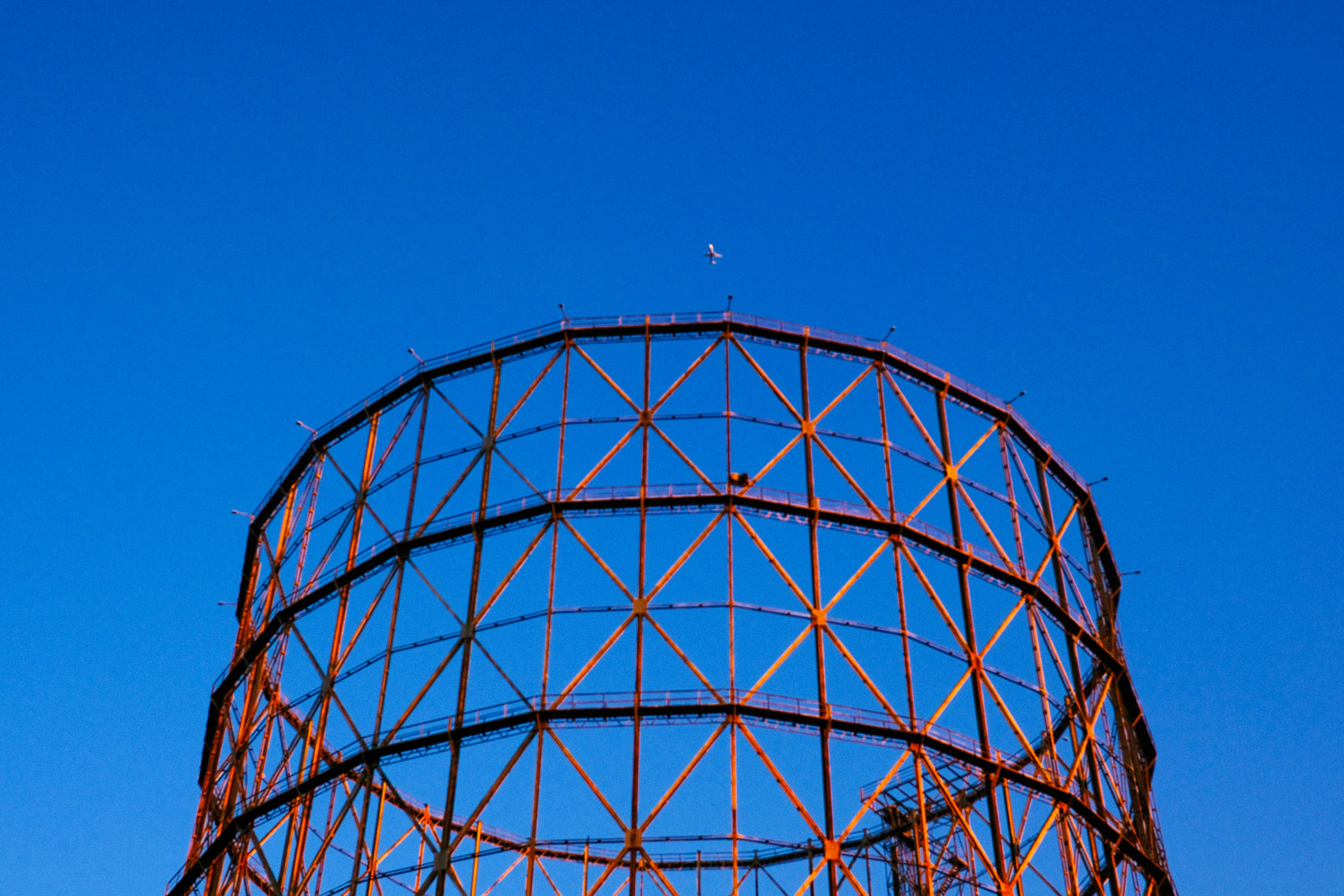 a large metal structure with a sky background