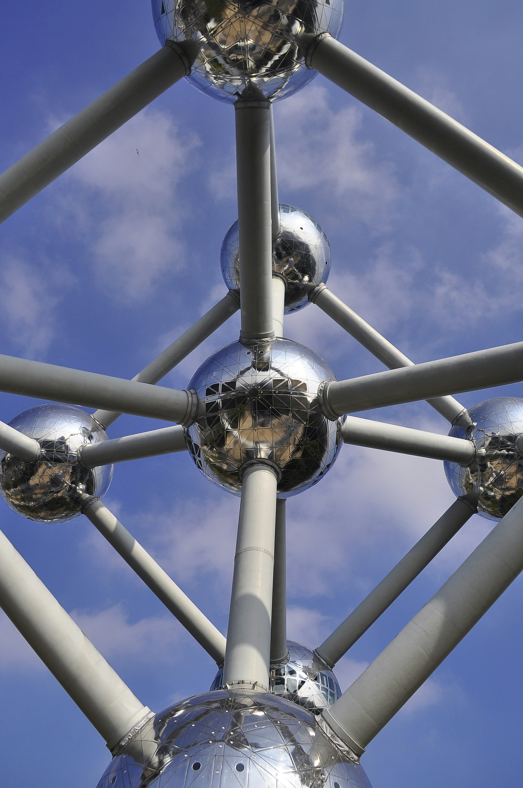 A large metal structure with many balls on it photo – Free Utility pole ...