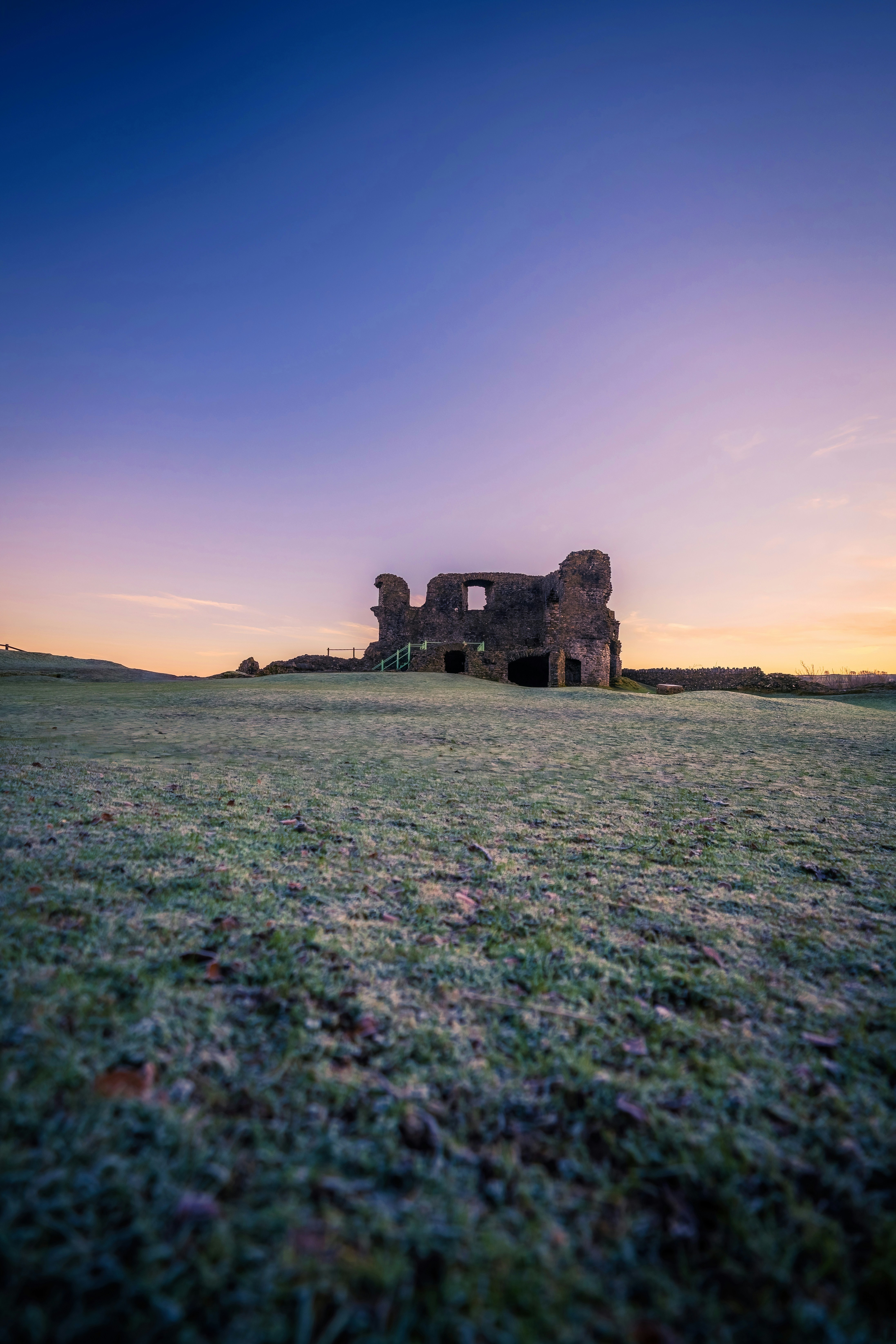 Sunset Over a Weathered Ruin: A Quiet Horizon