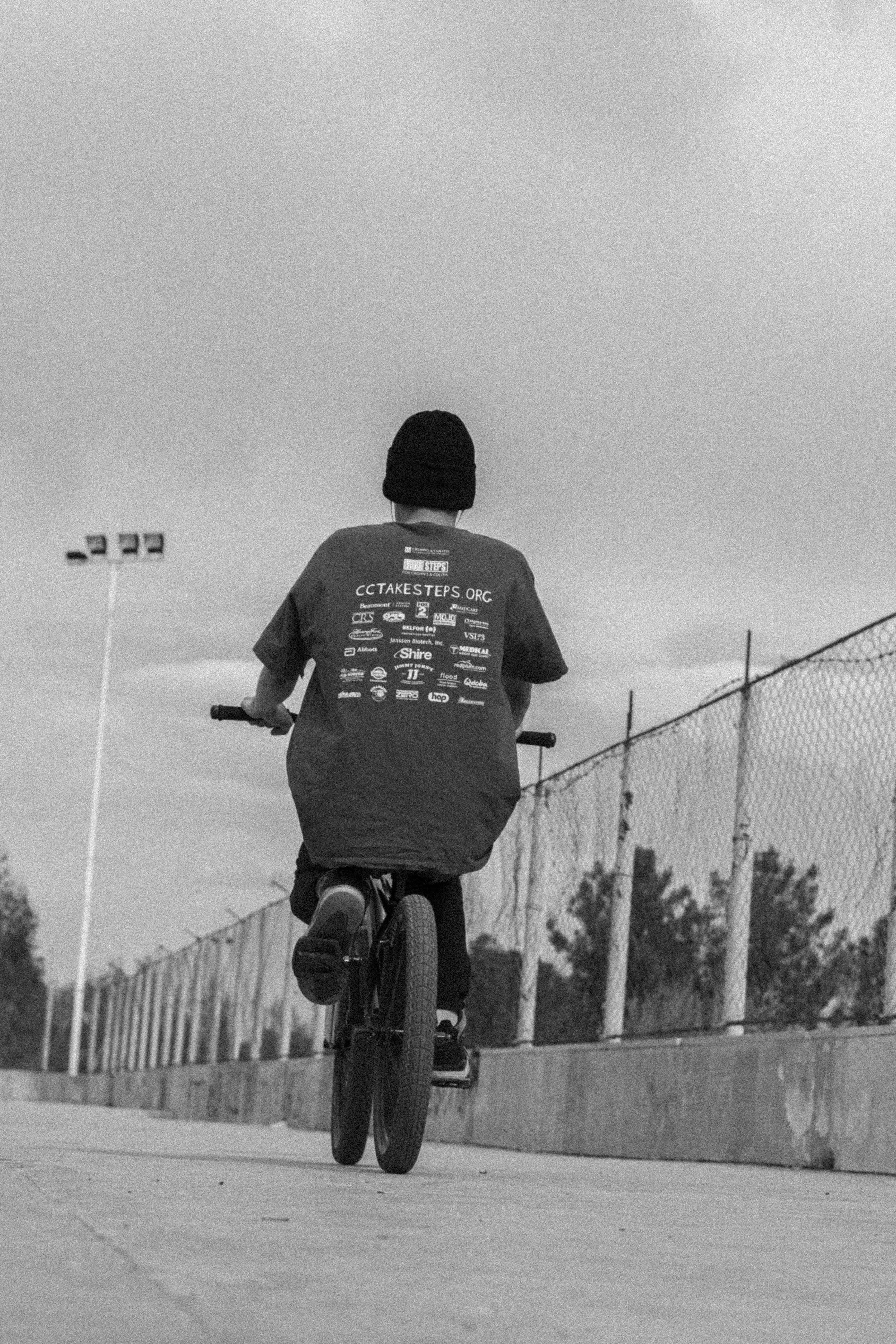 Rear View on a BMX: A Quiet Ride Along the Fence
