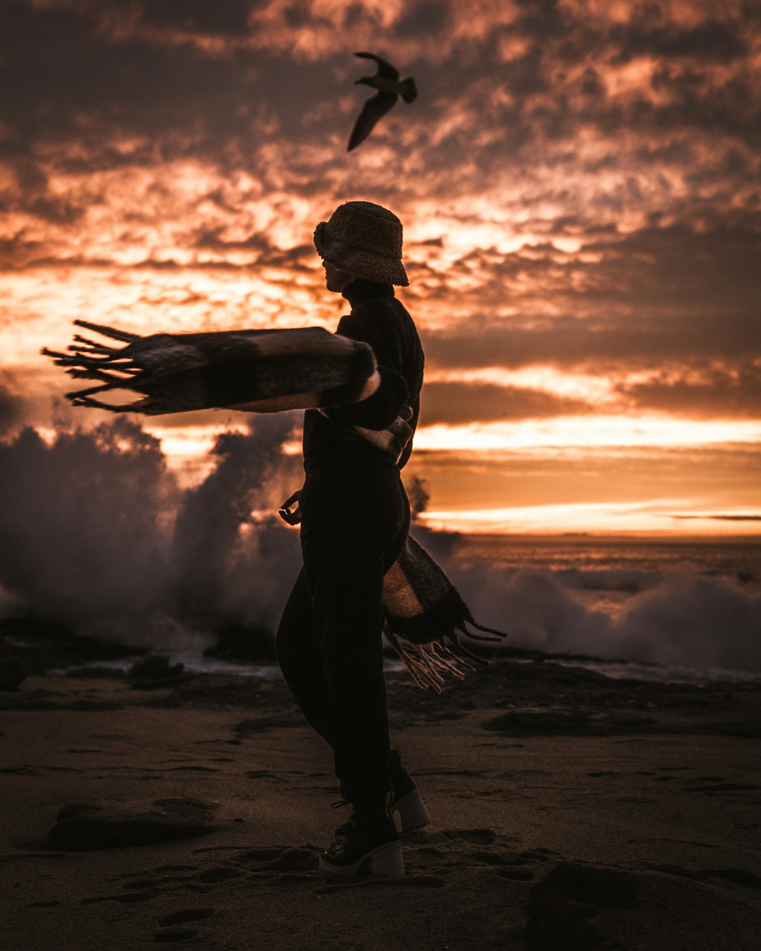 Silhouette of a Windthrower on a Piercing Sunset