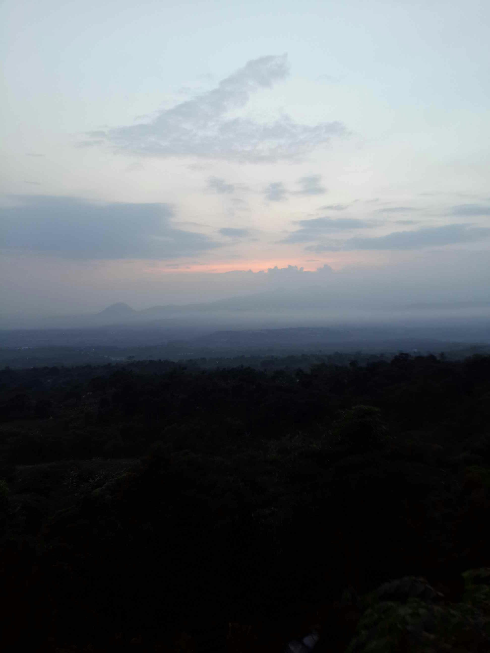 Dawn Veil Over a Quiet Valley: A Misty Horizon and Lone Peak