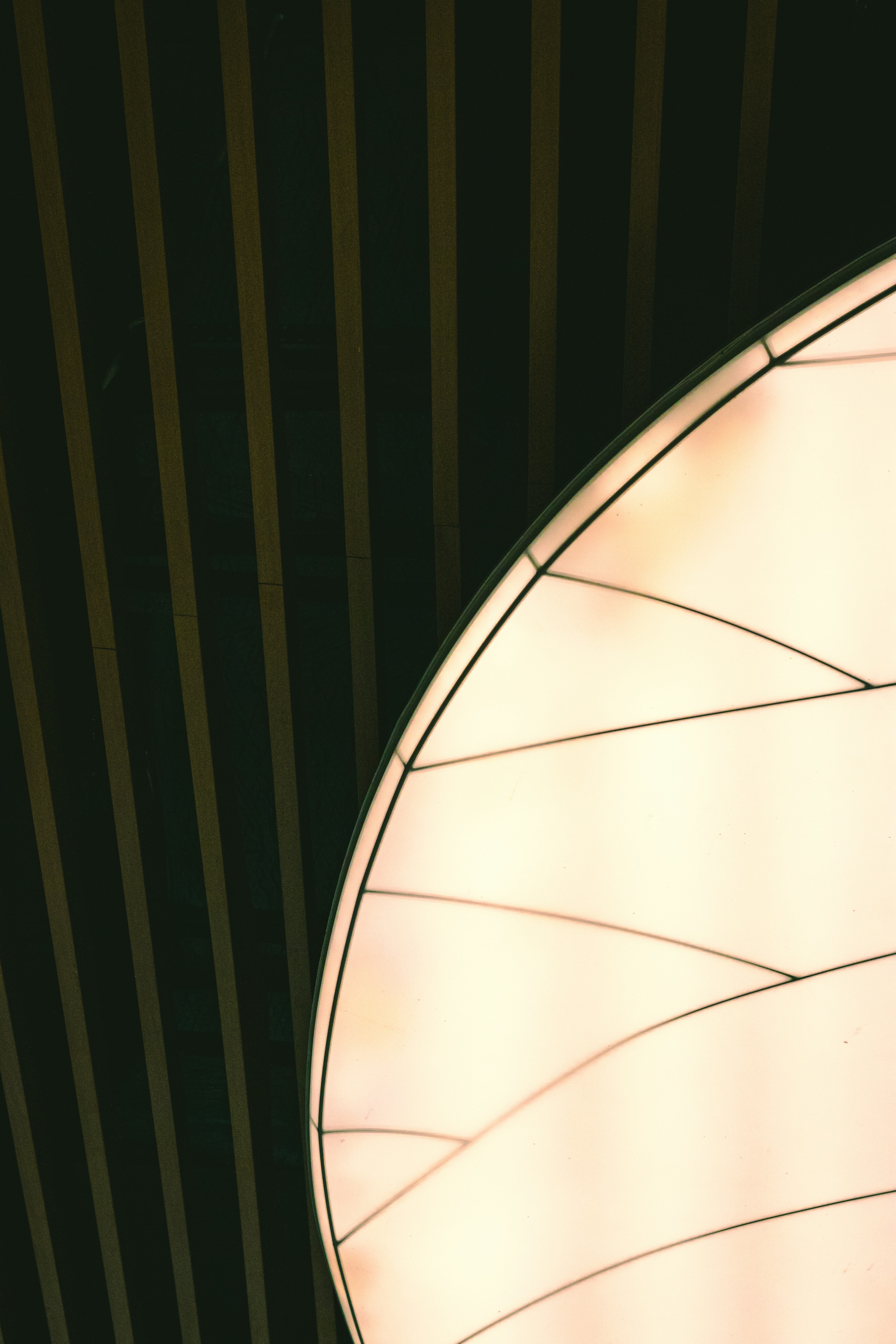 Gilded Crescent Against Velvet Stripes: A Warm Light Study