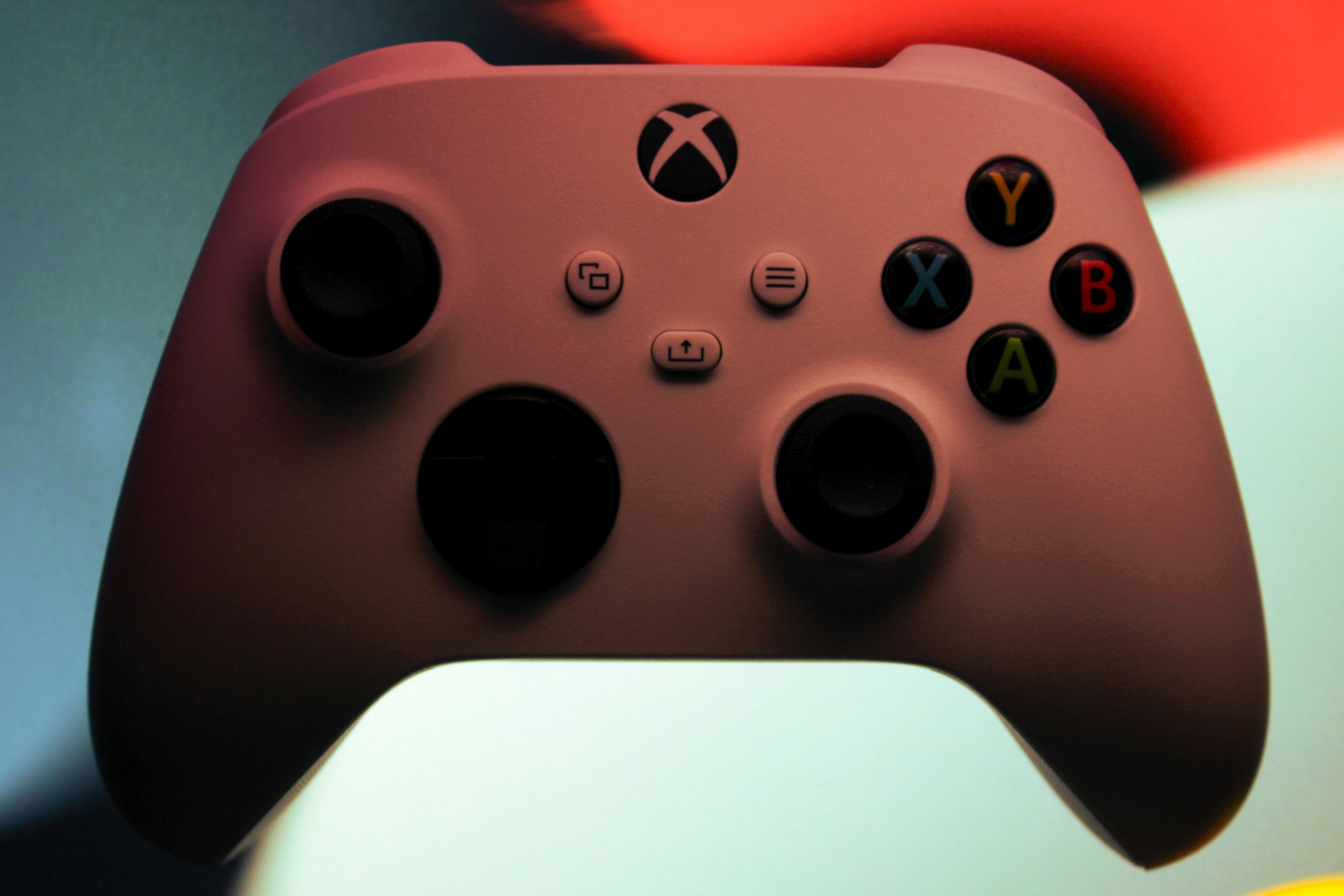 A close up of a video game controller photo – Free Dark Image on Unsplash