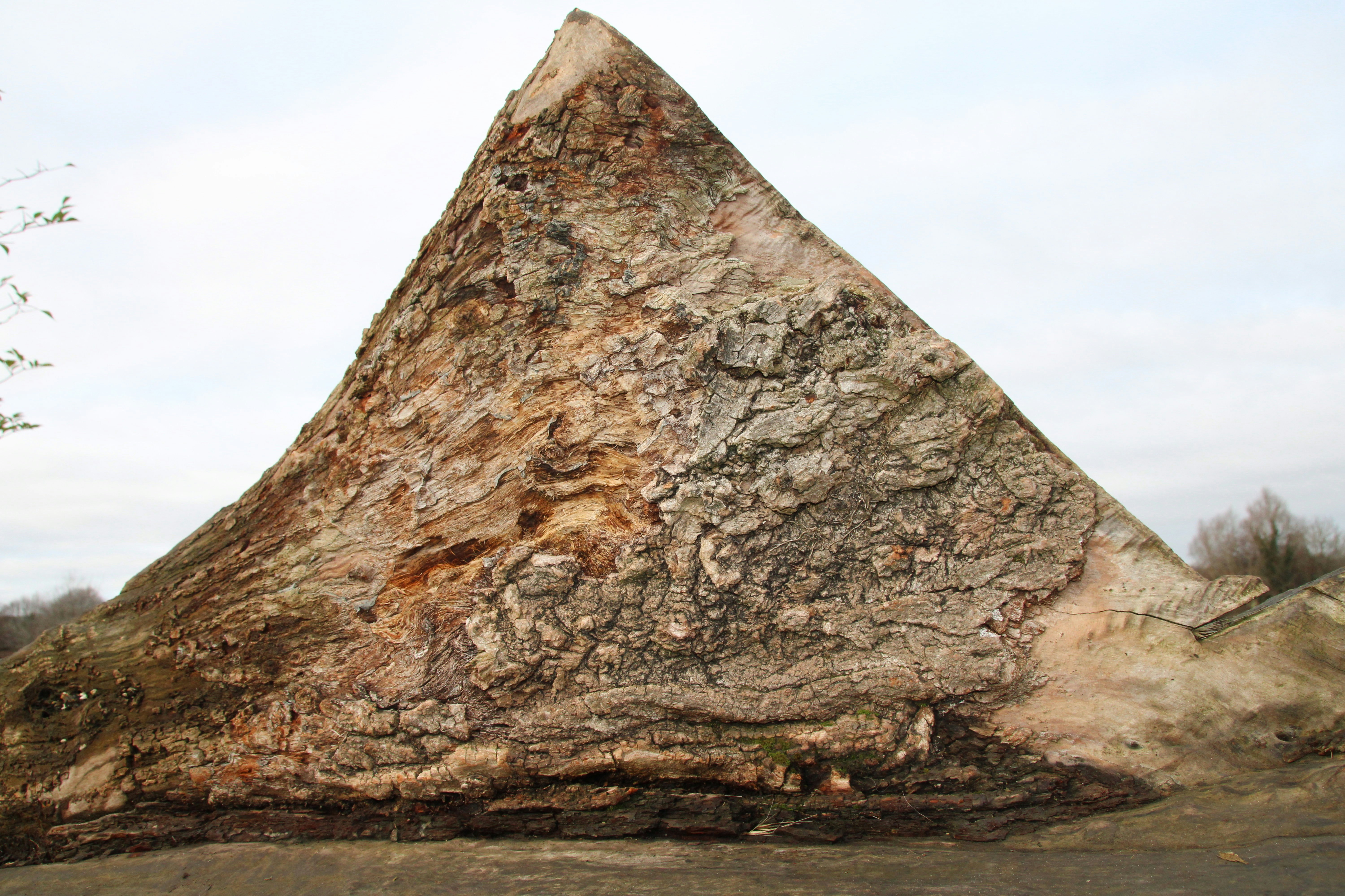 A very large rock with a very large triangular shape photo – Free ...