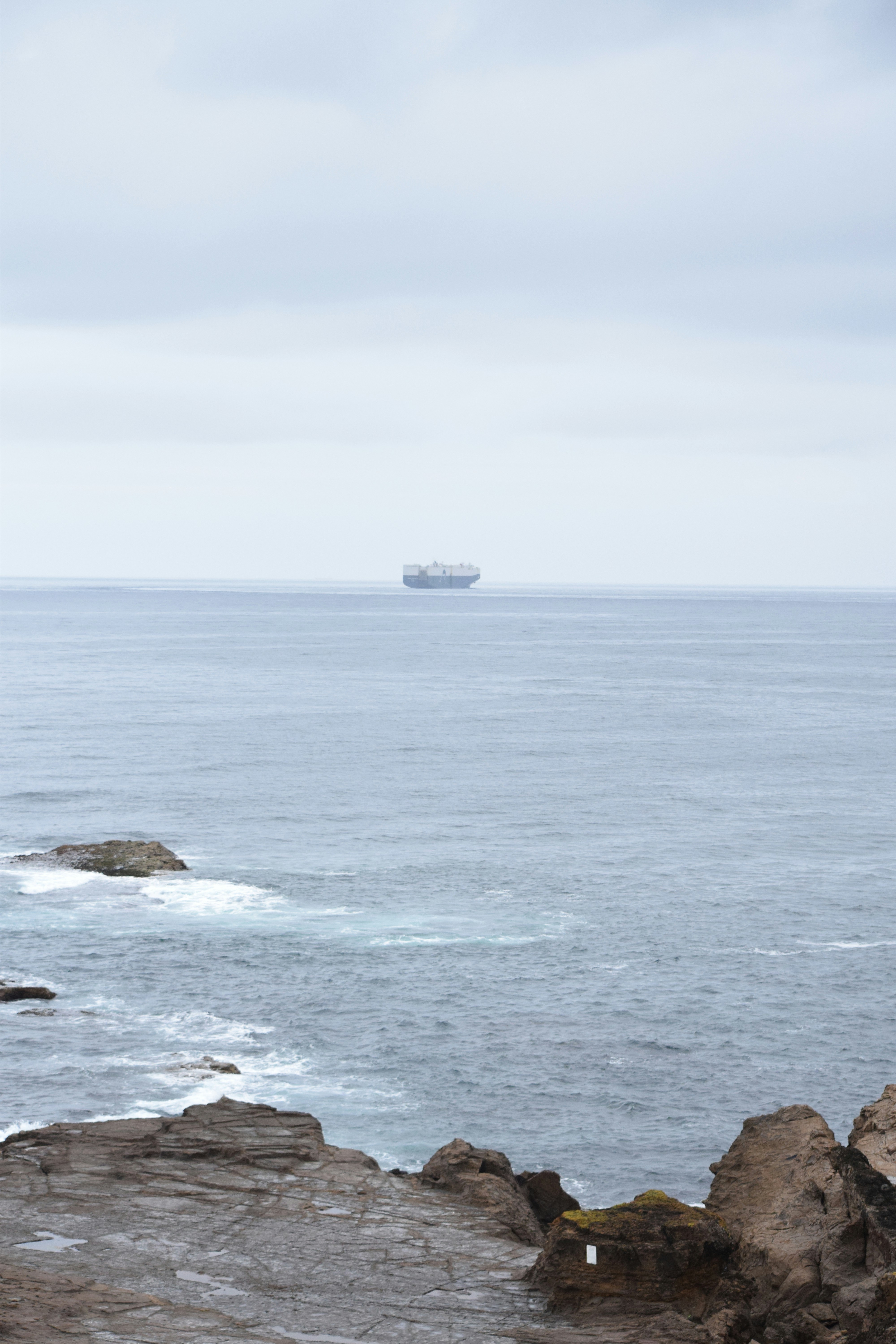 Distant Freighter on a Pale Atlantic Horizon