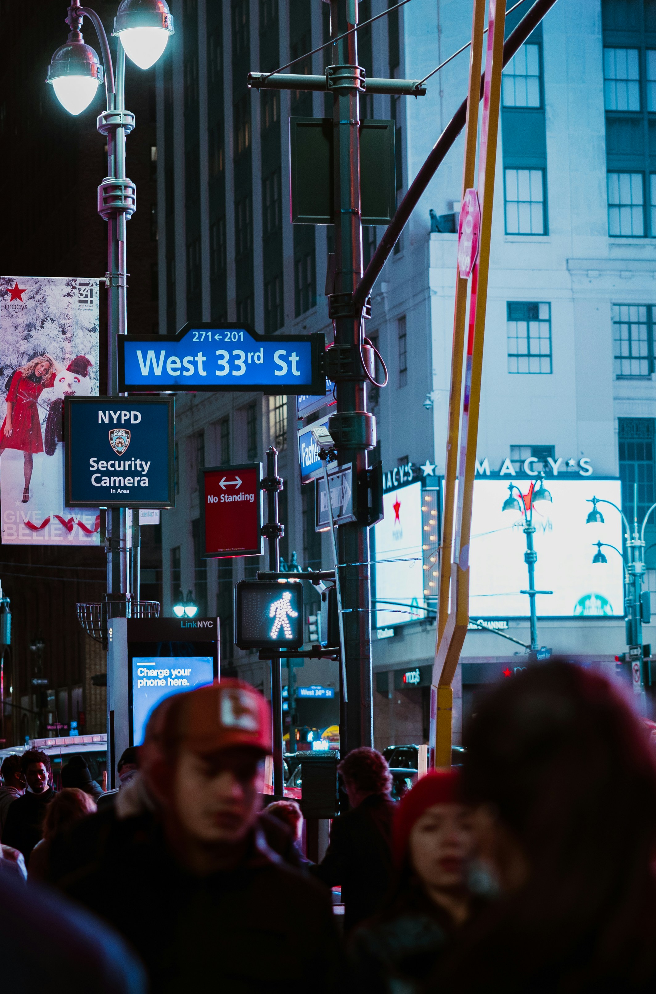 Neon Crossroads: West 33rd Street Pulse Under Blue Night Signage