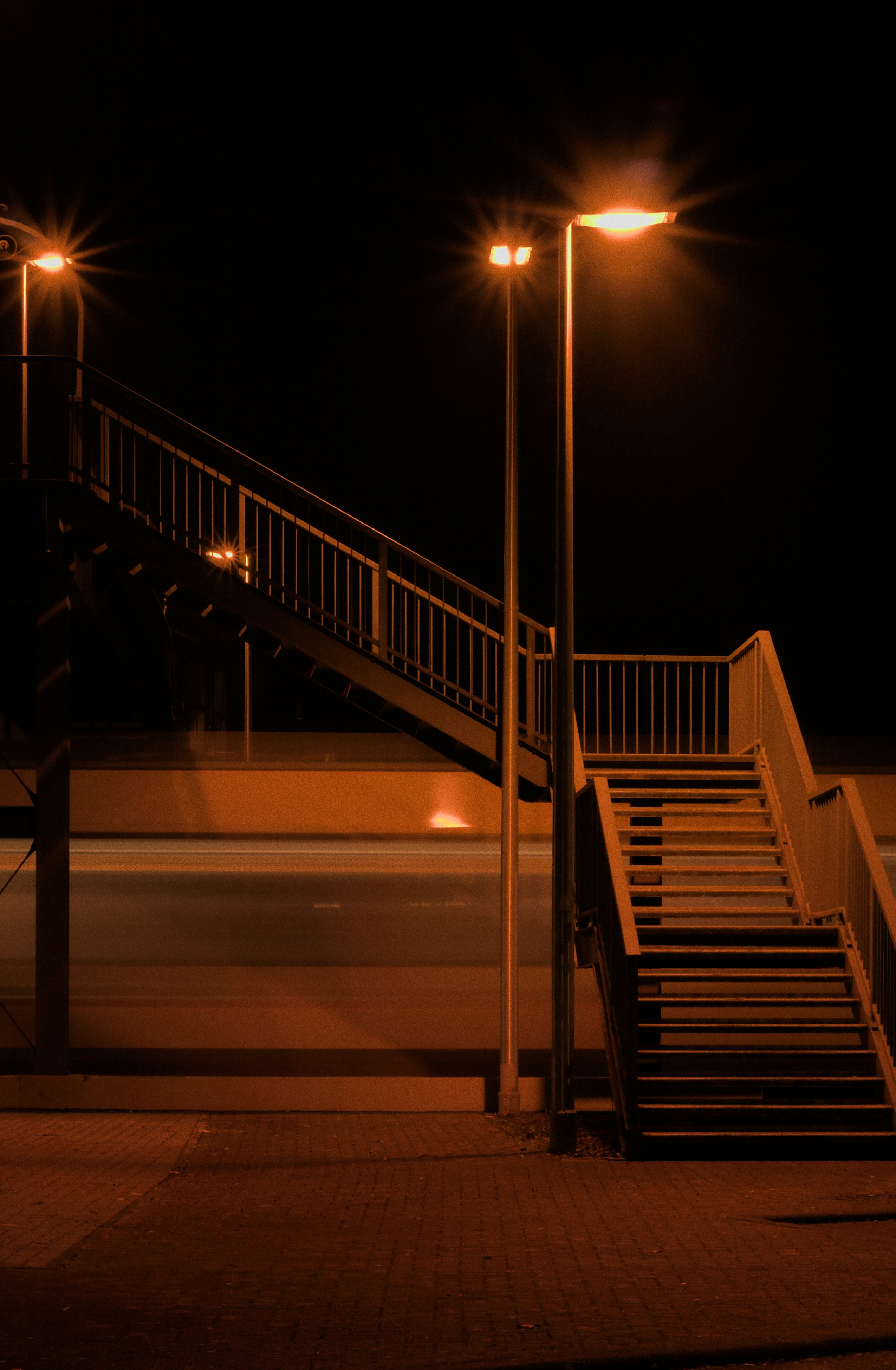A set of stairs leading up to a street light photo – Free Staircase ...