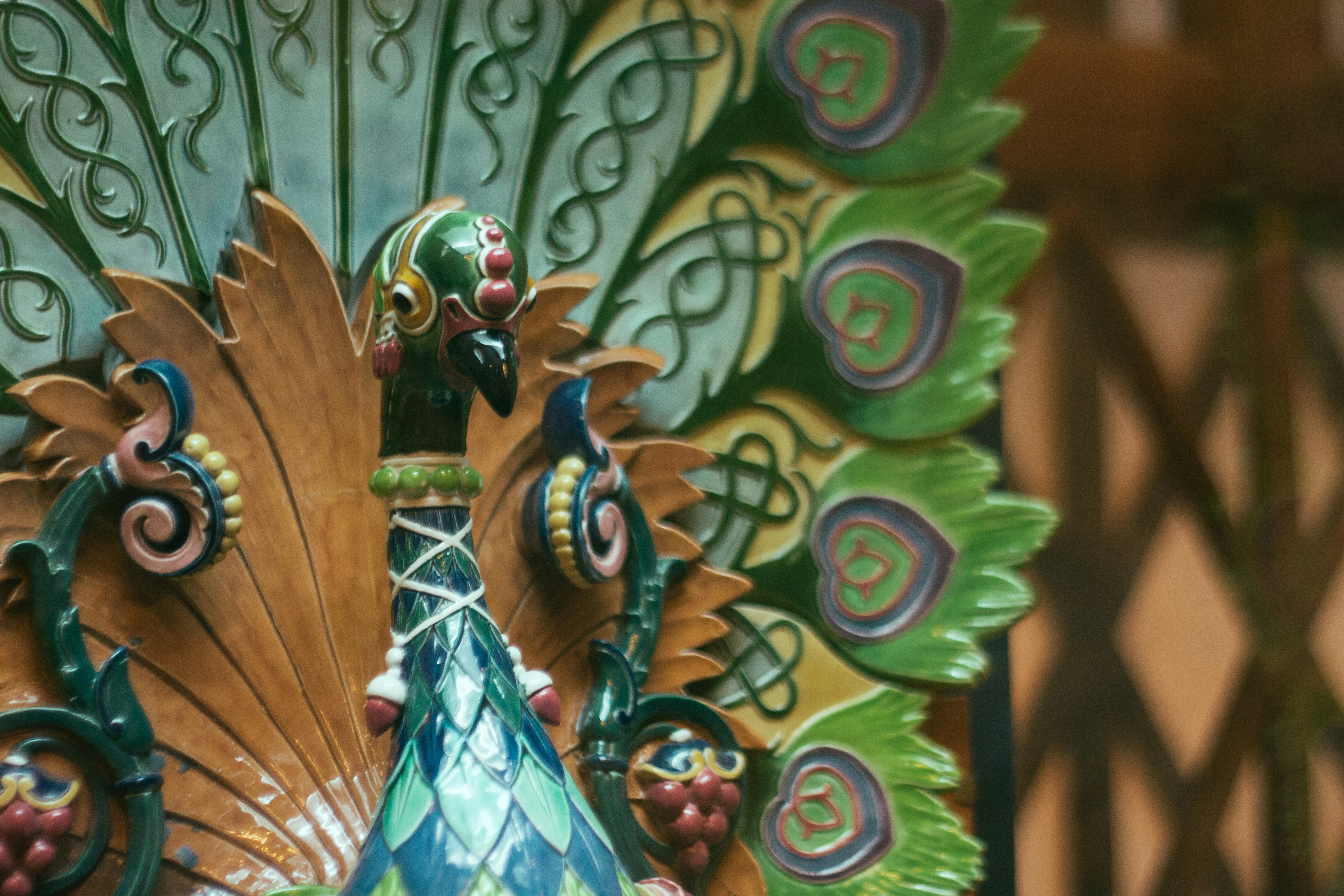 a close up of a peacock statue on display