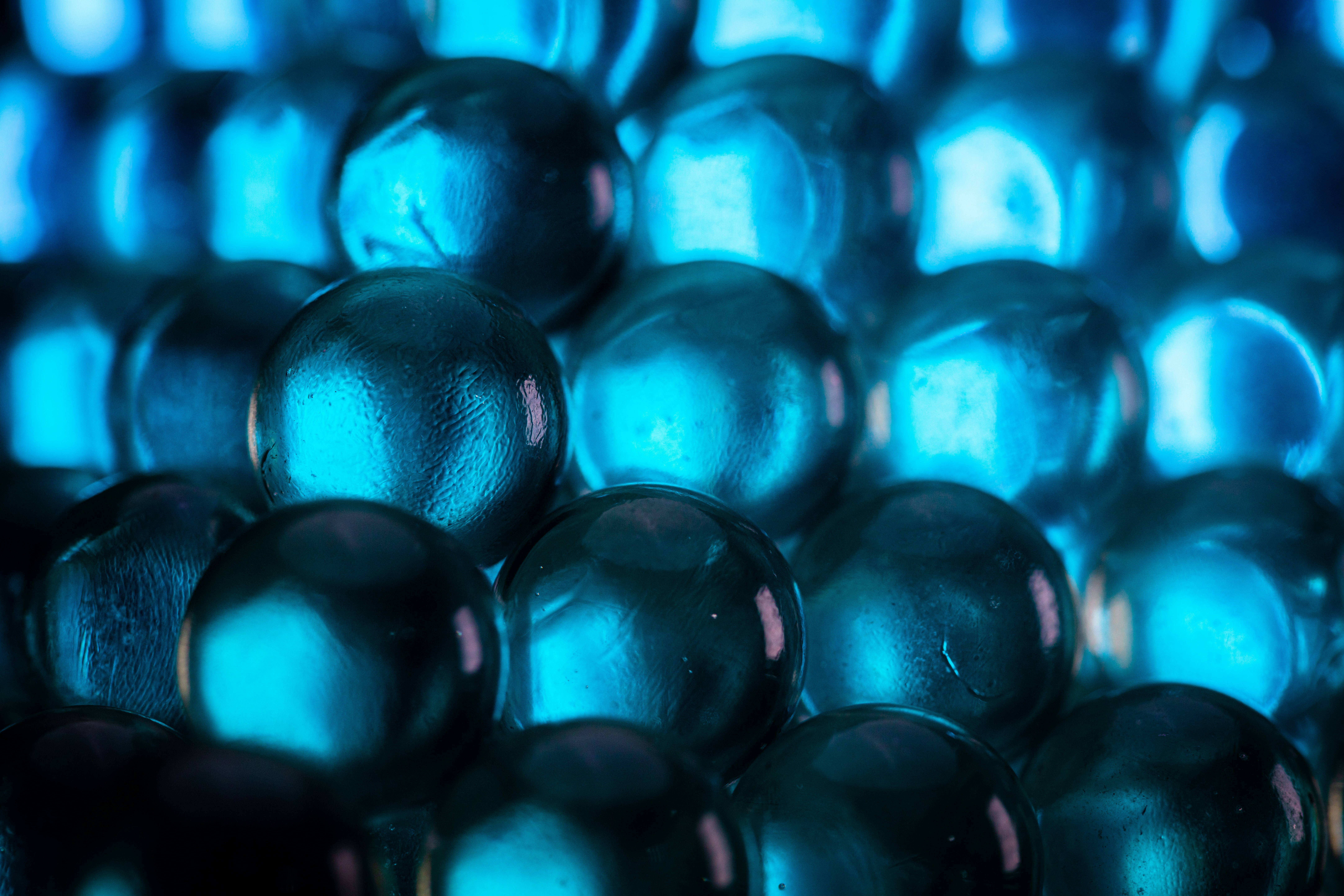 A bunch of shiny blue balls in a pile photo – Free Spheres Image on ...