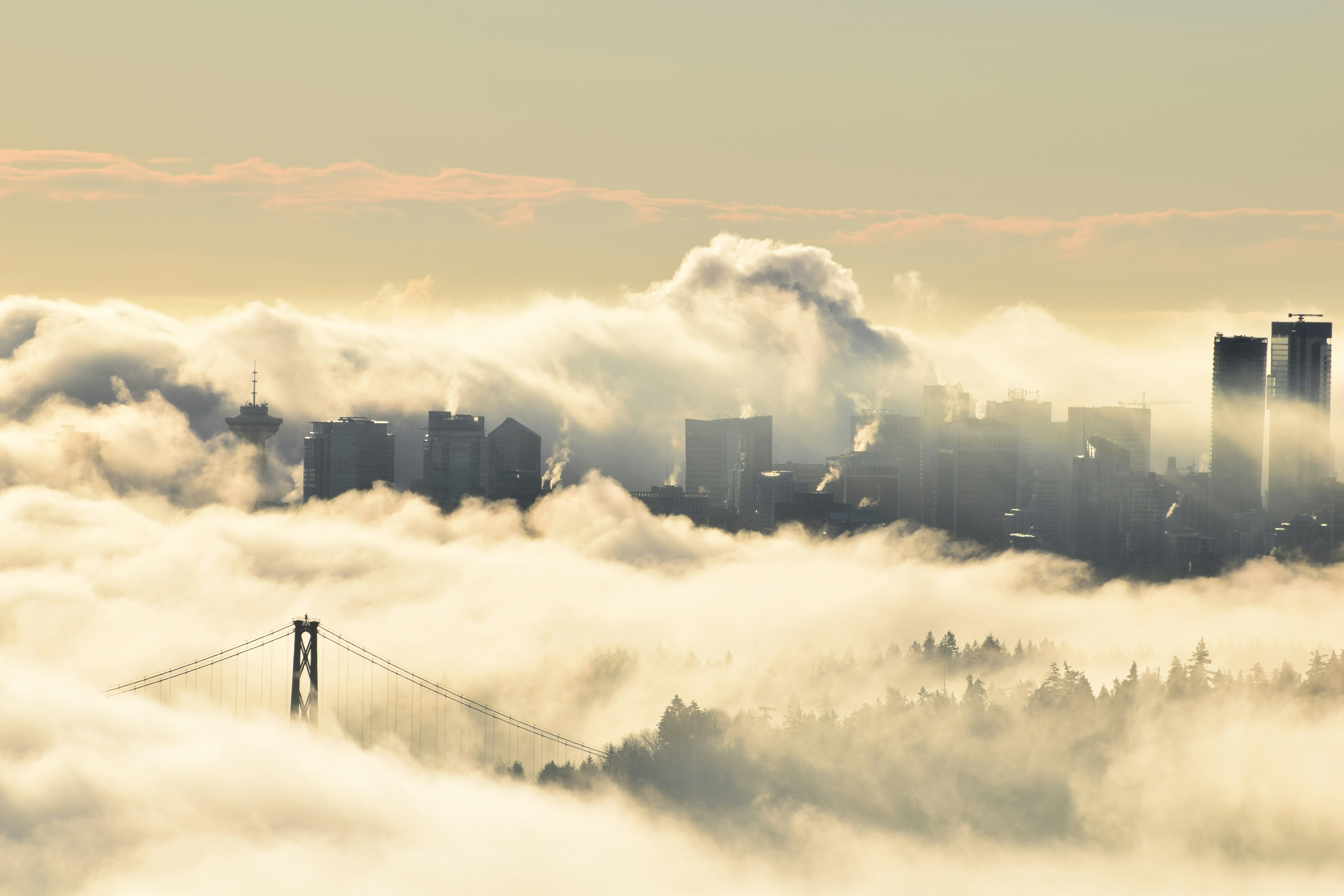 Dawn Veil Over the City: A Bridge Emerges from the Clouds