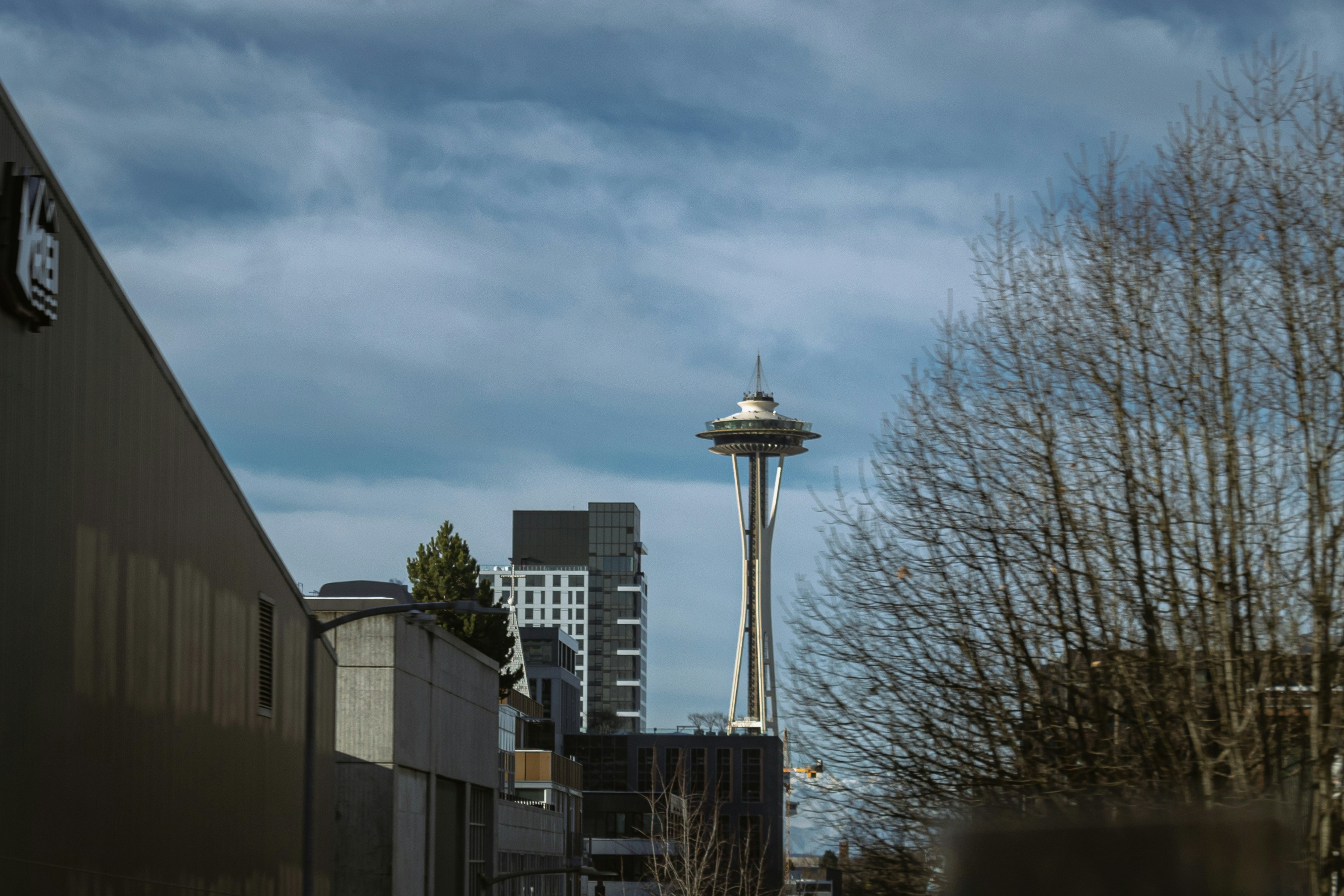 Distant Space Needle Above a Quiet Seattle Street