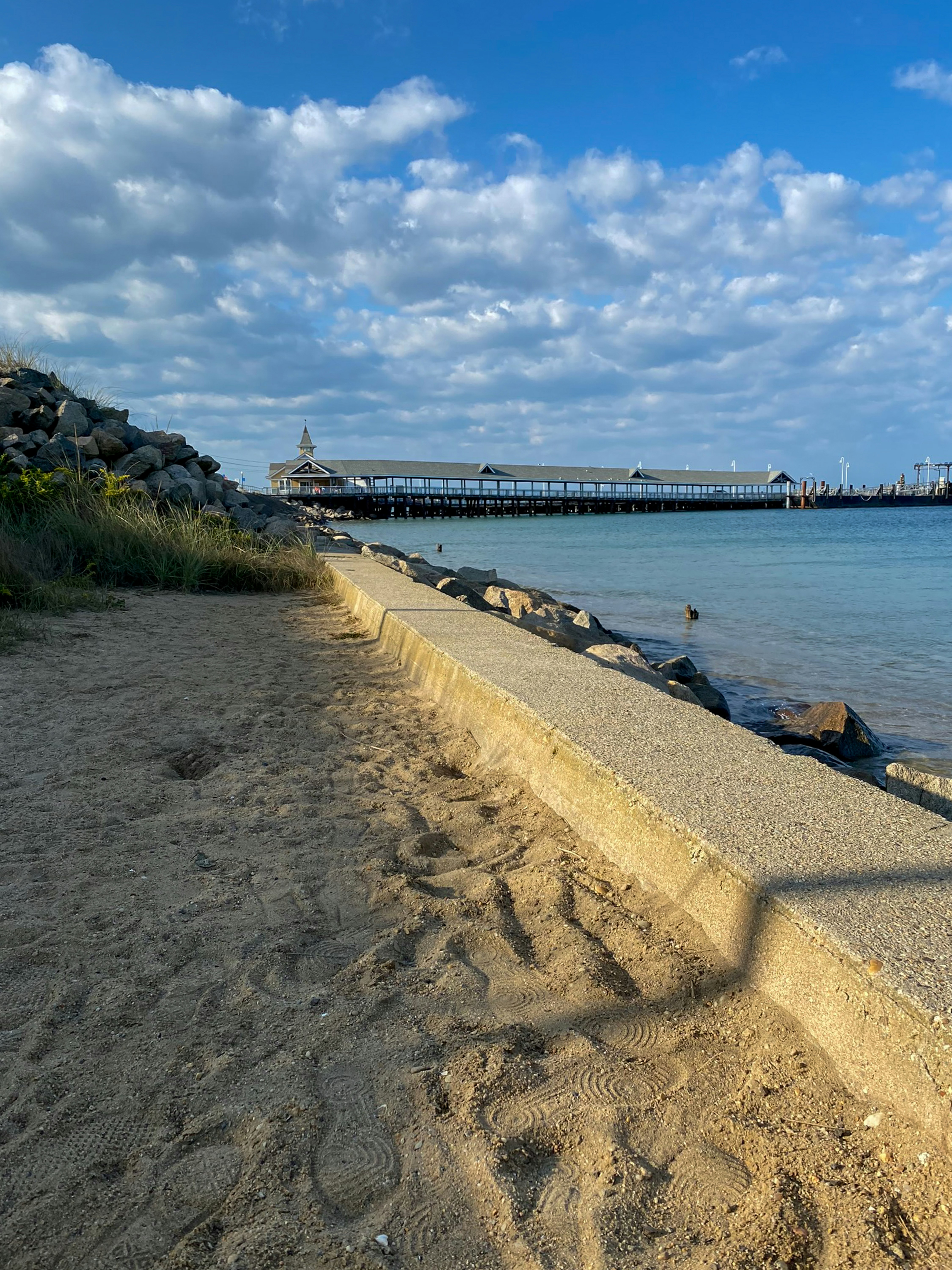 A sandy beach next to a body of water photo – Free Martha's vineyard ...