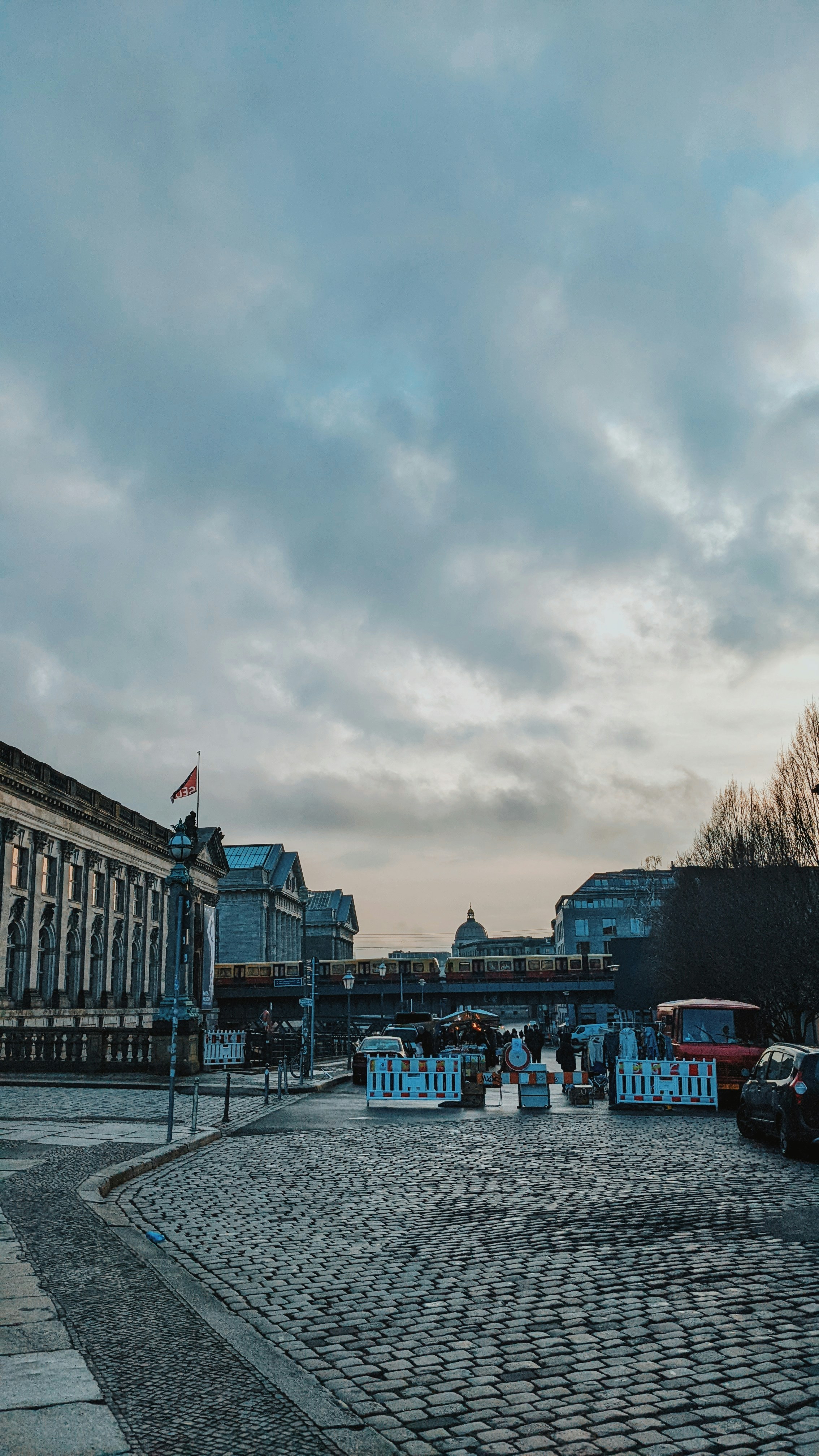 Cobblestone Avenue Beneath A Quiet Sky