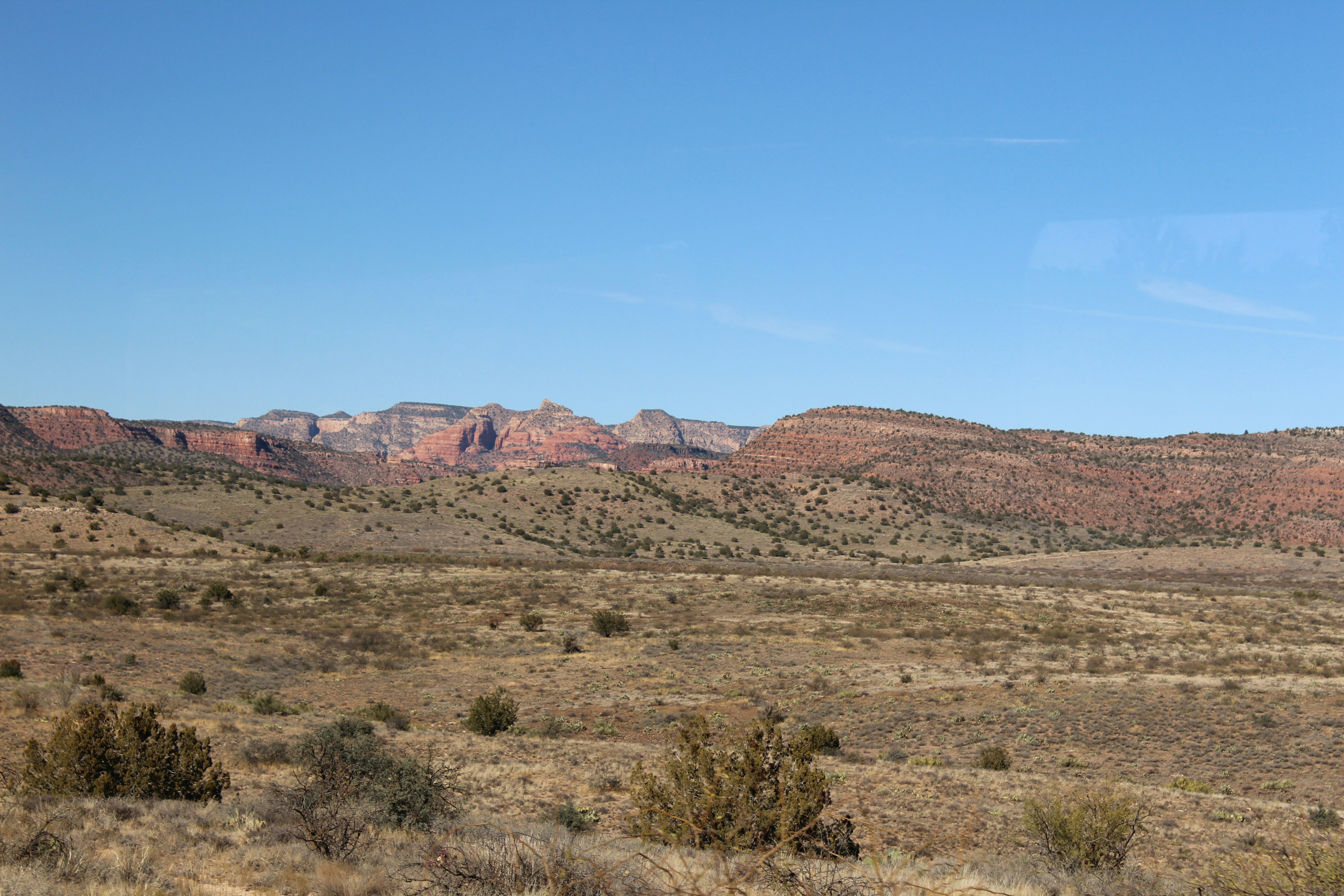 Red rock mountains under a clear blue sky in the Sonoran Desert near Cottonwood, AZ.