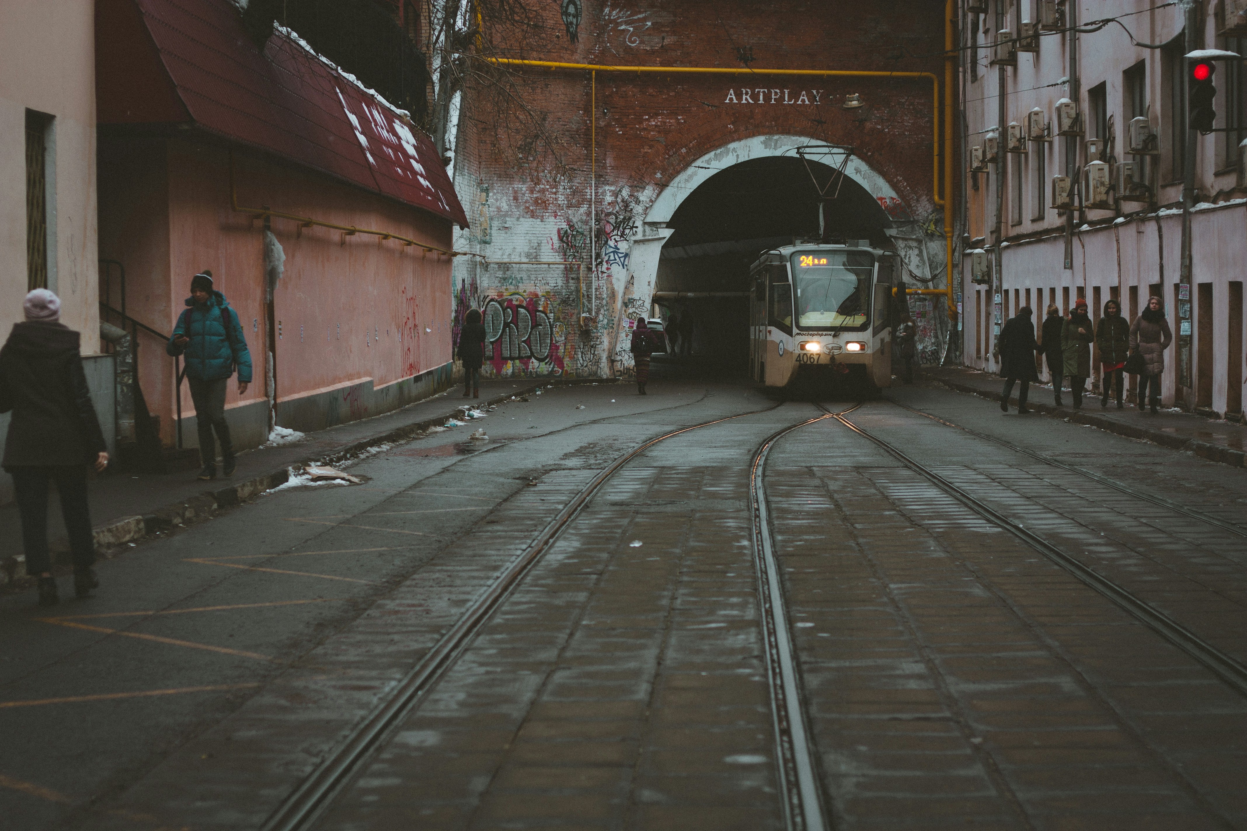 Tunnel of Rails: Trainside Evening in a Weathered City