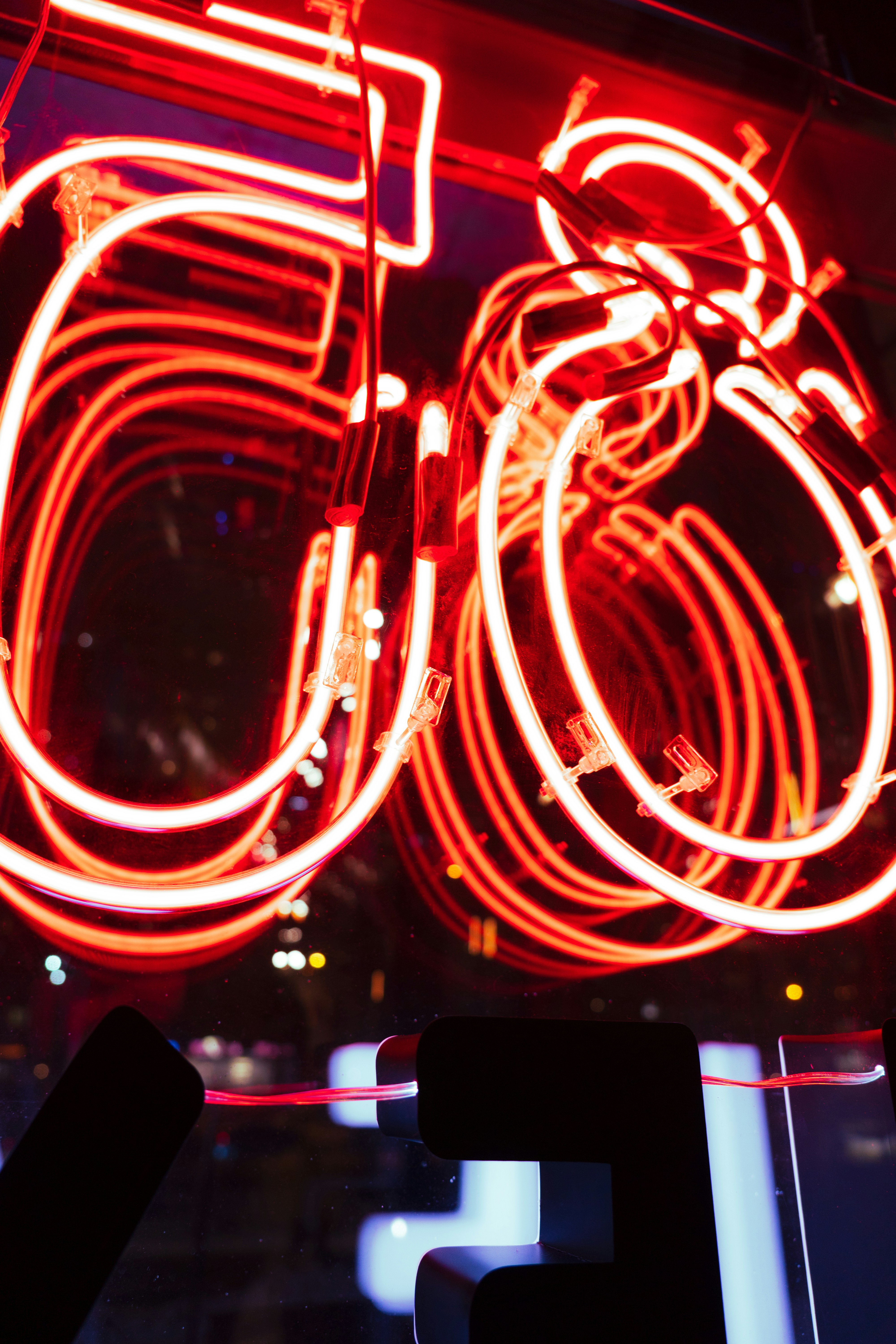 a close up of a neon bicycle sign