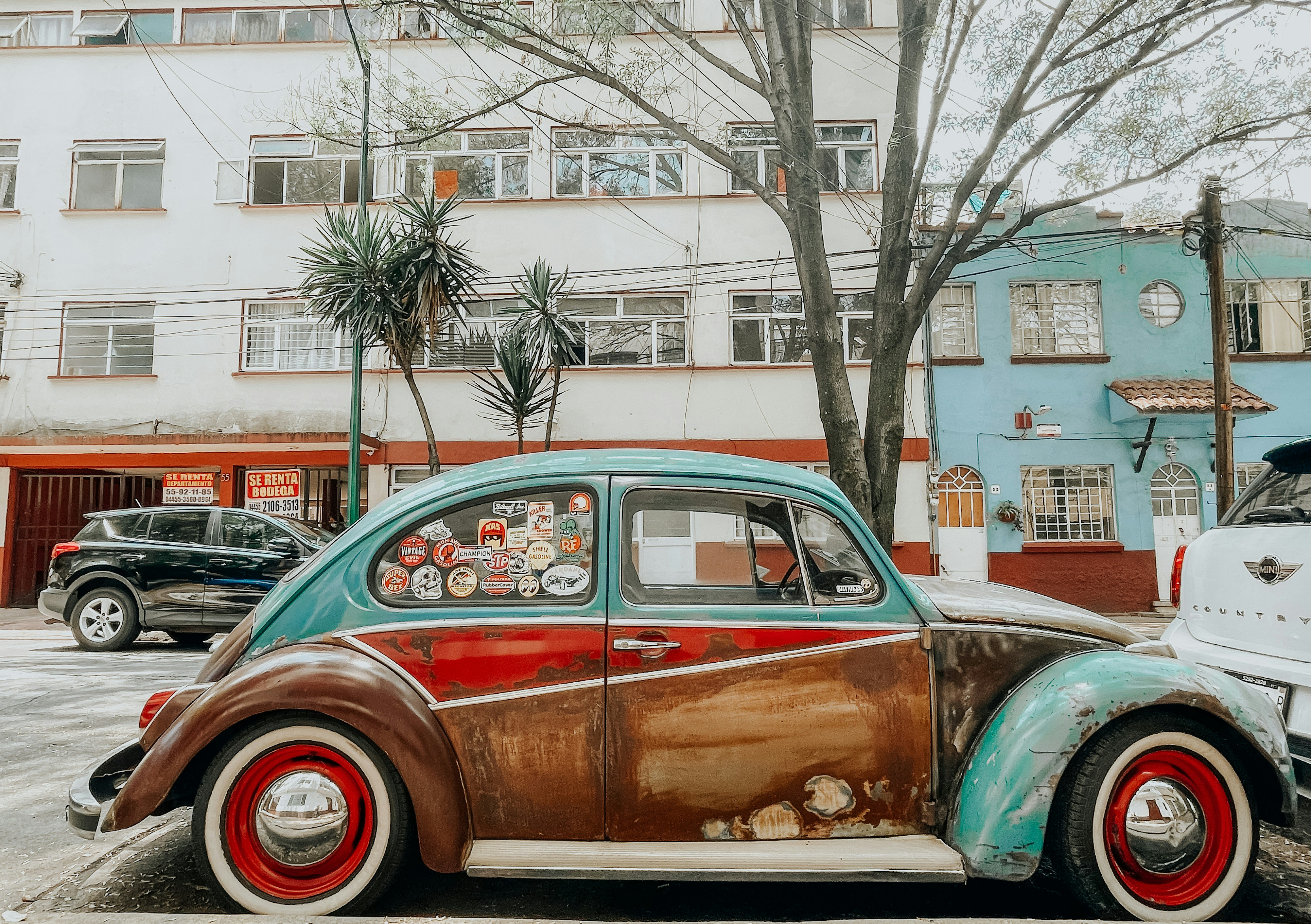 an old car parked on the side of the road