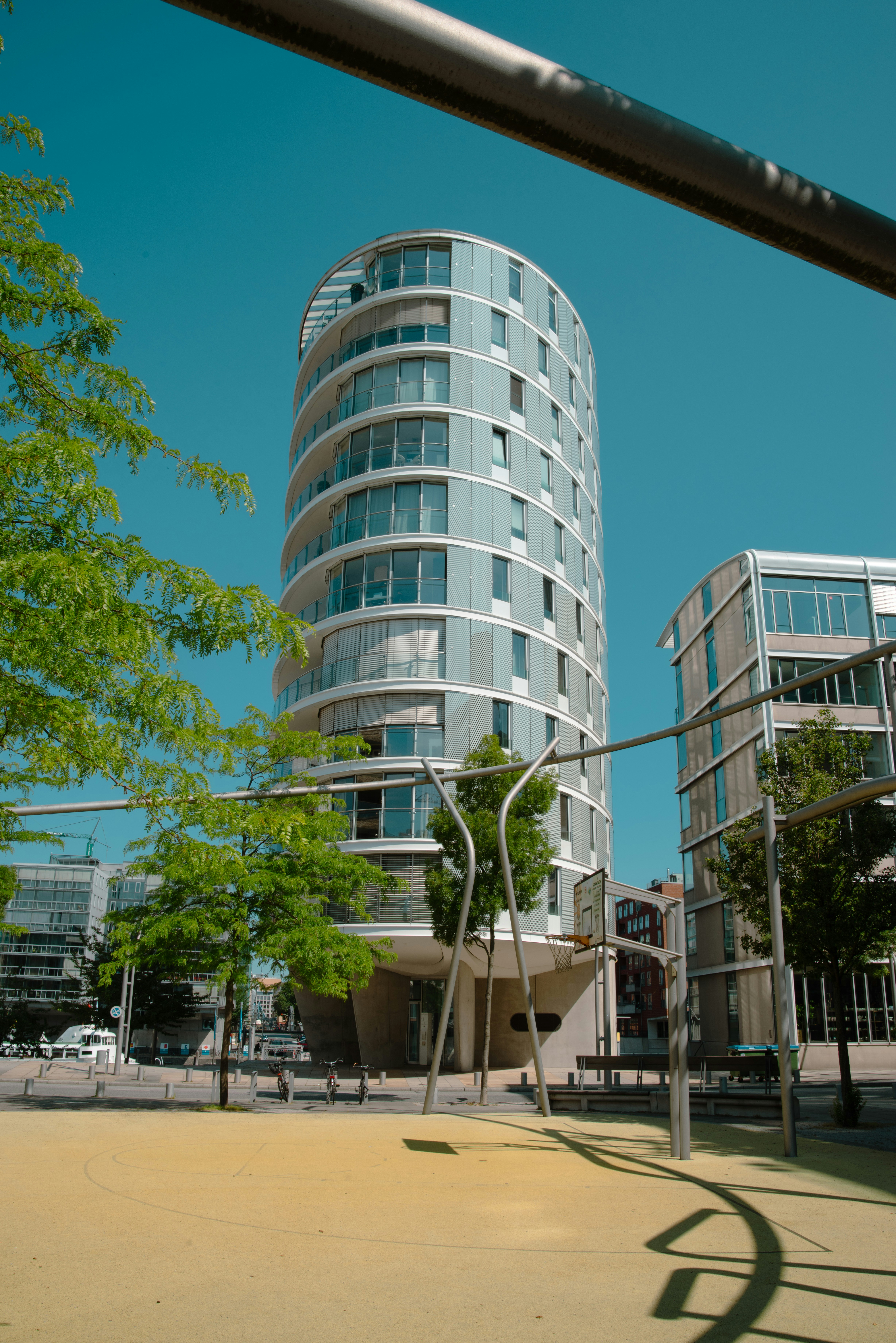 a tall building sitting next to a tall metal pole