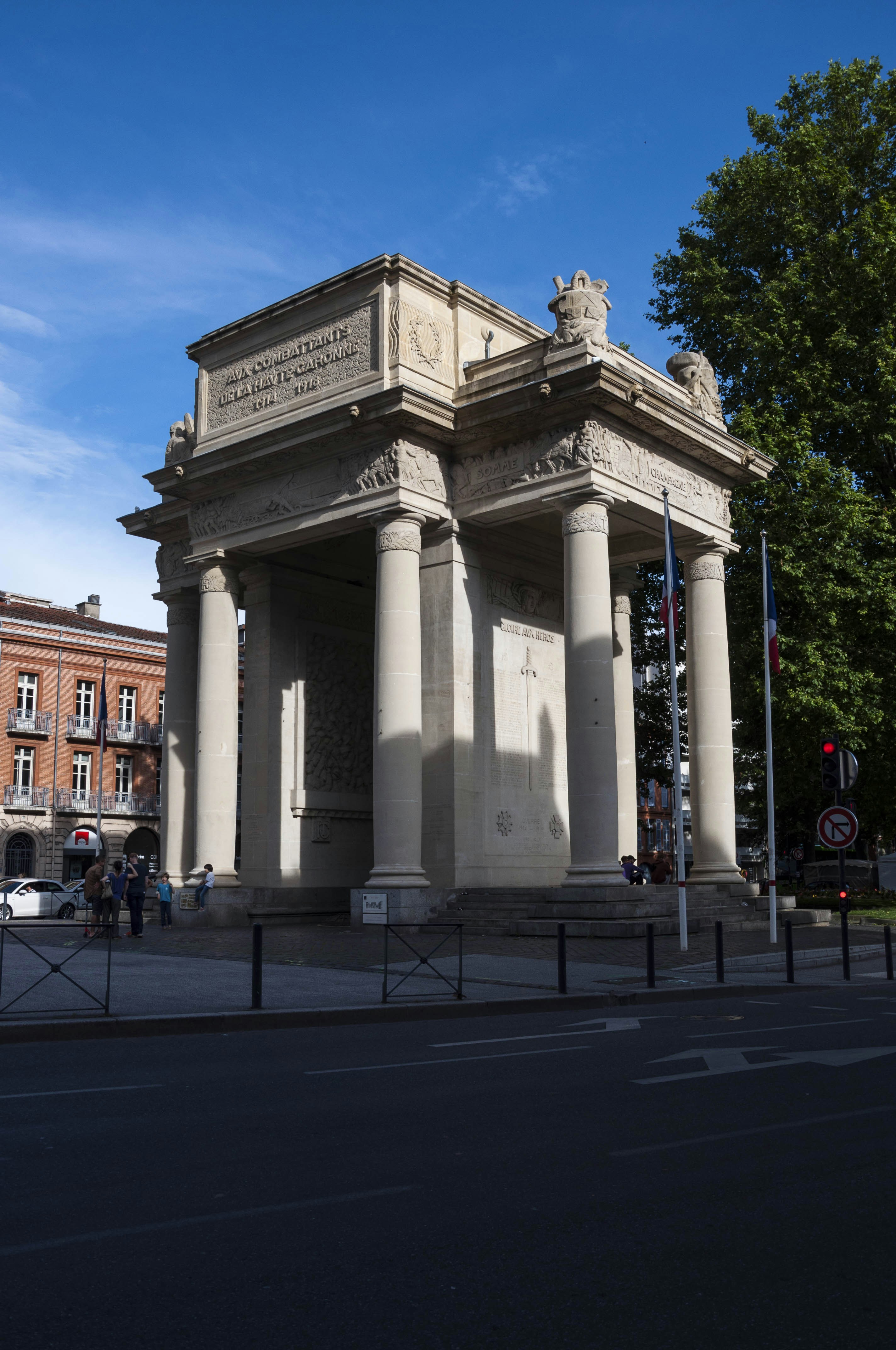 A large stone structure sitting on the side of a road photo – Free ...